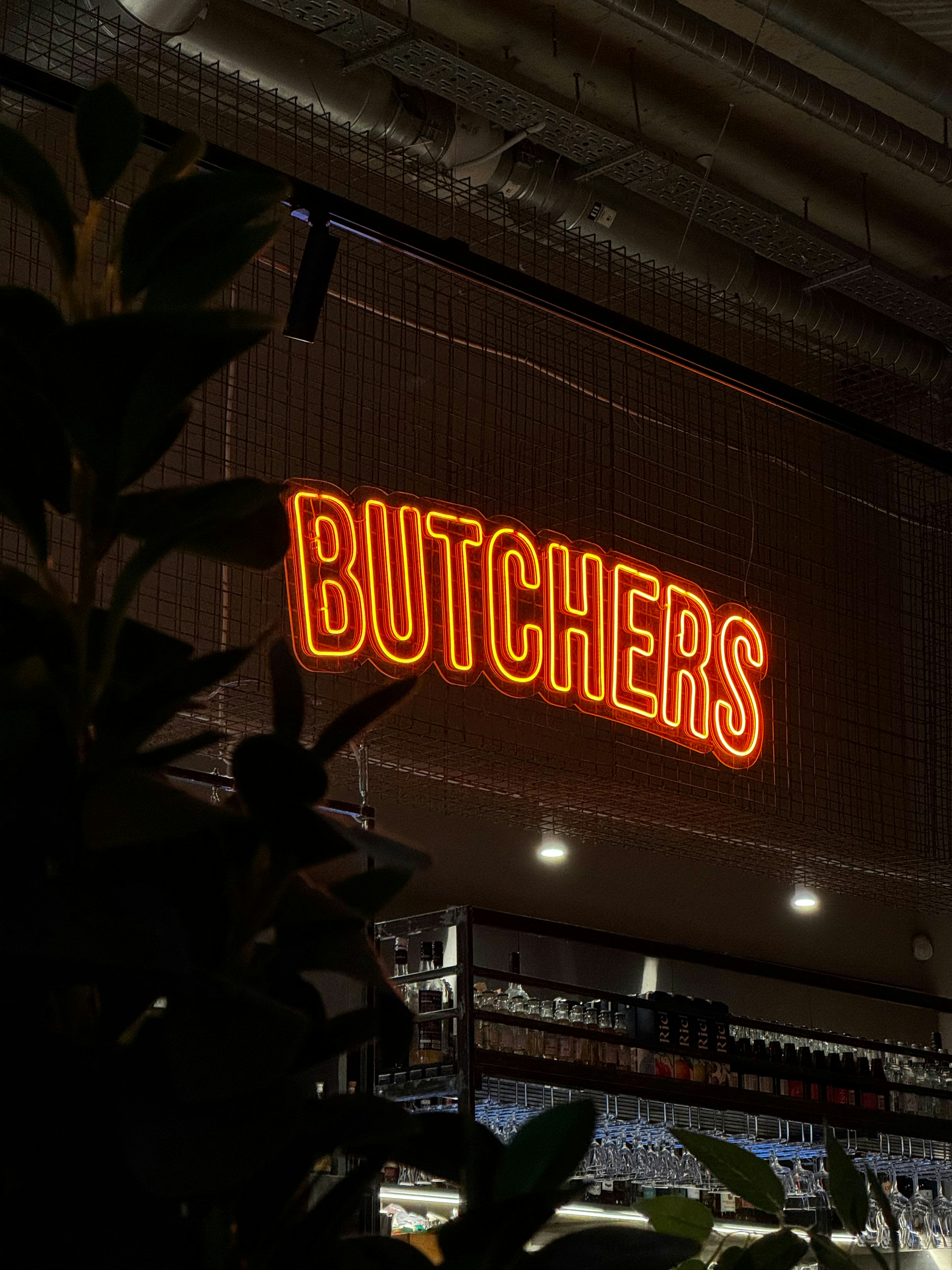 Neon Butchers Sign Illuminates a Dim Interior