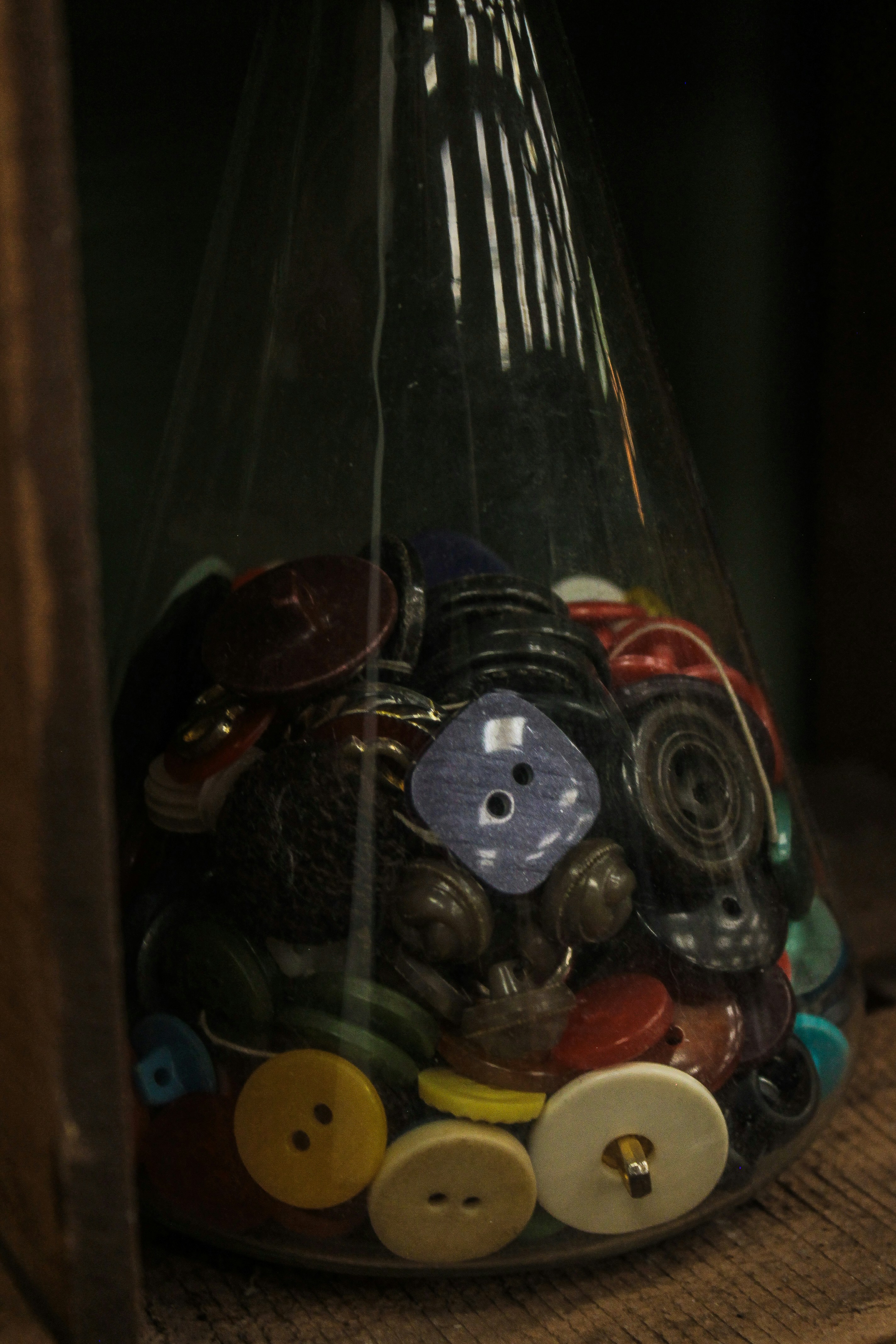 Glass Cone of Colors: A Bottle Neck Filled with Hidden Buttons