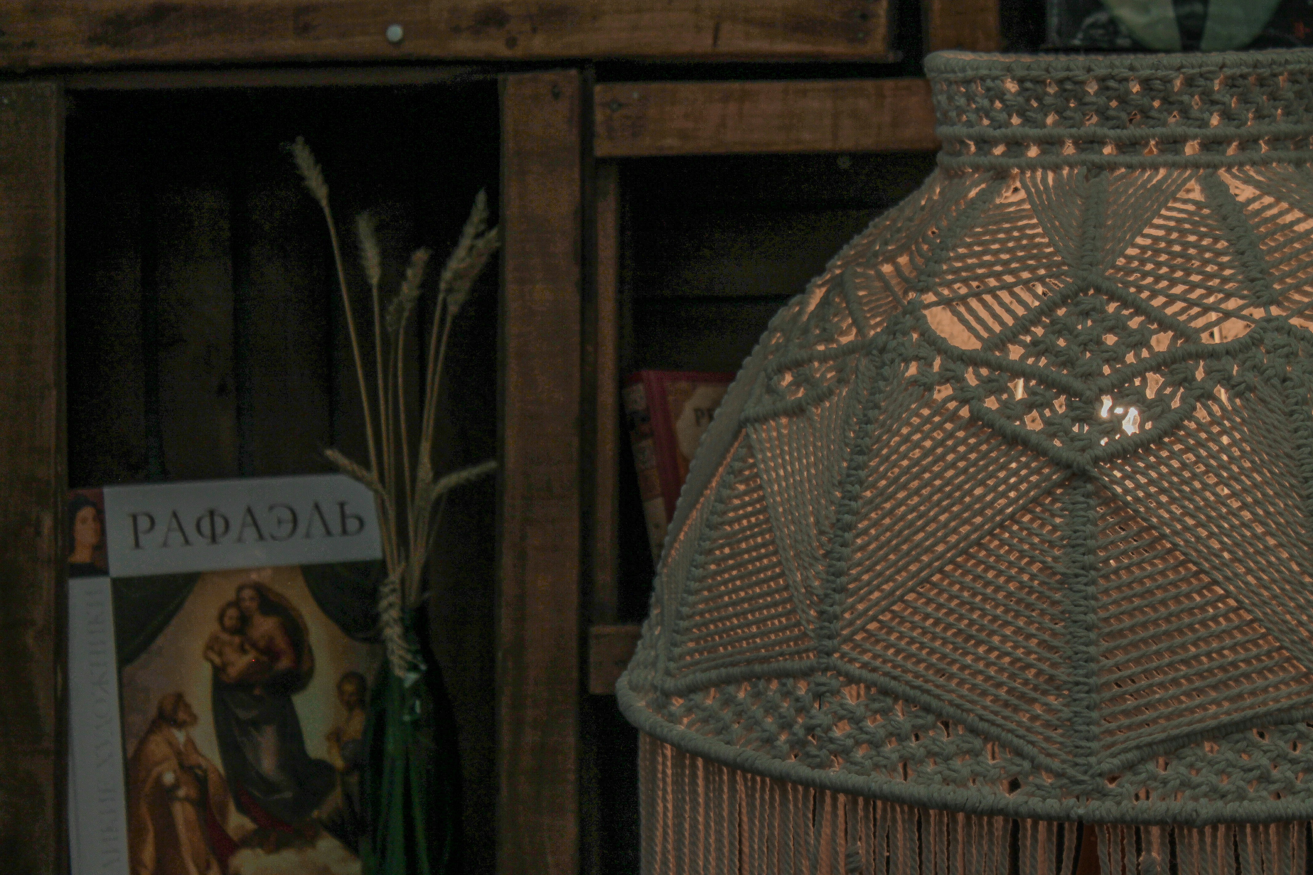 Amber Lamp Shrouded Shelf: Quiet Corner of a Vintage Interior