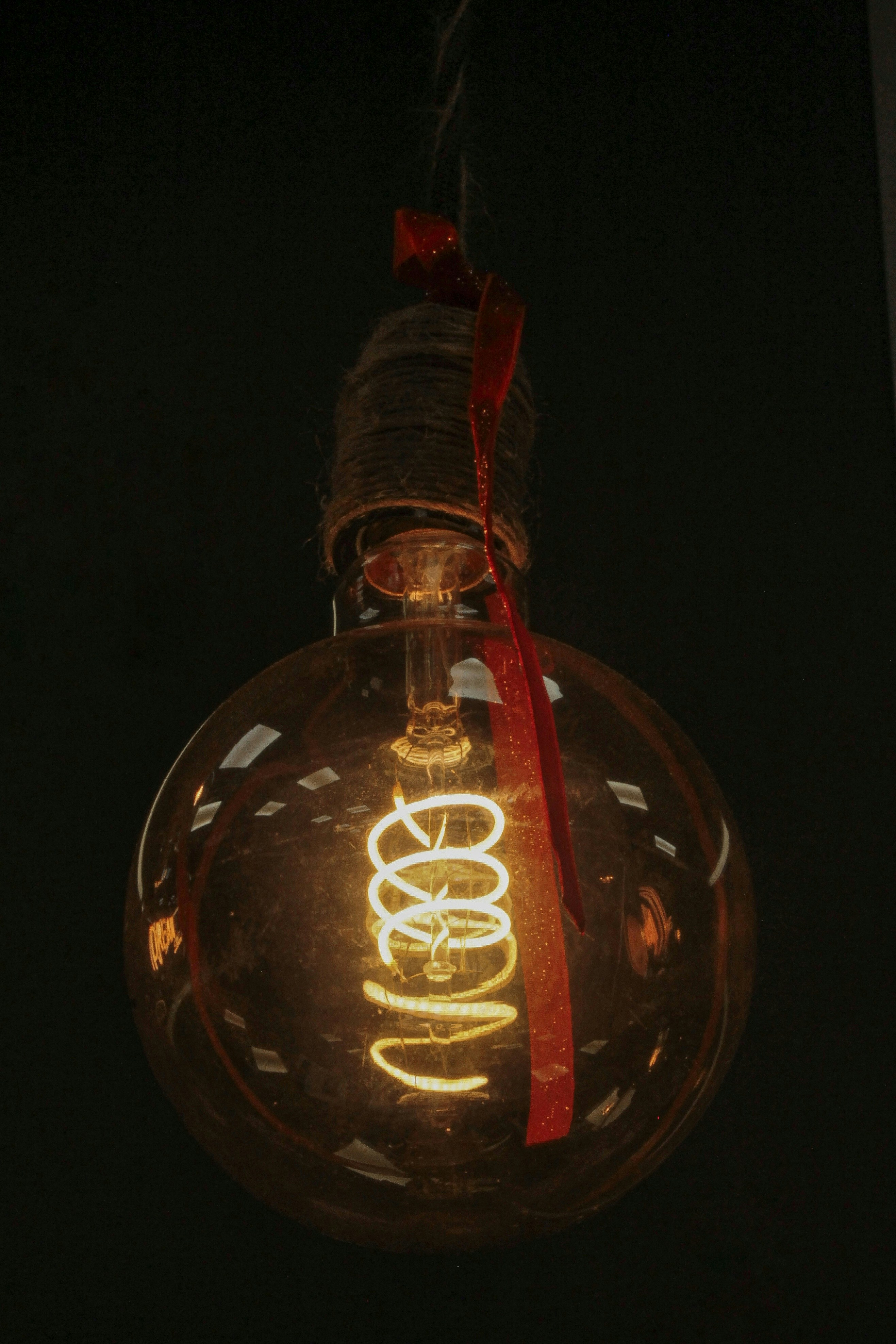Glow of the Vintage Bulb: An Illuminated Spiral Within a Glass Sphere