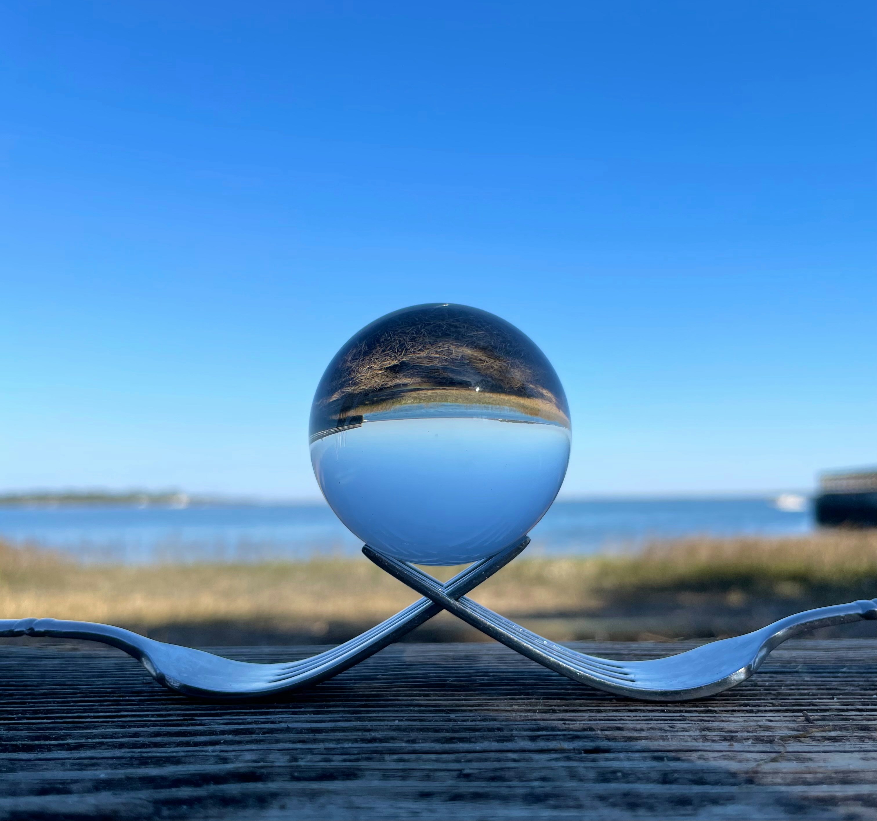 Orb on a Distant Shore: A Glassy World in a Tiny Sphere