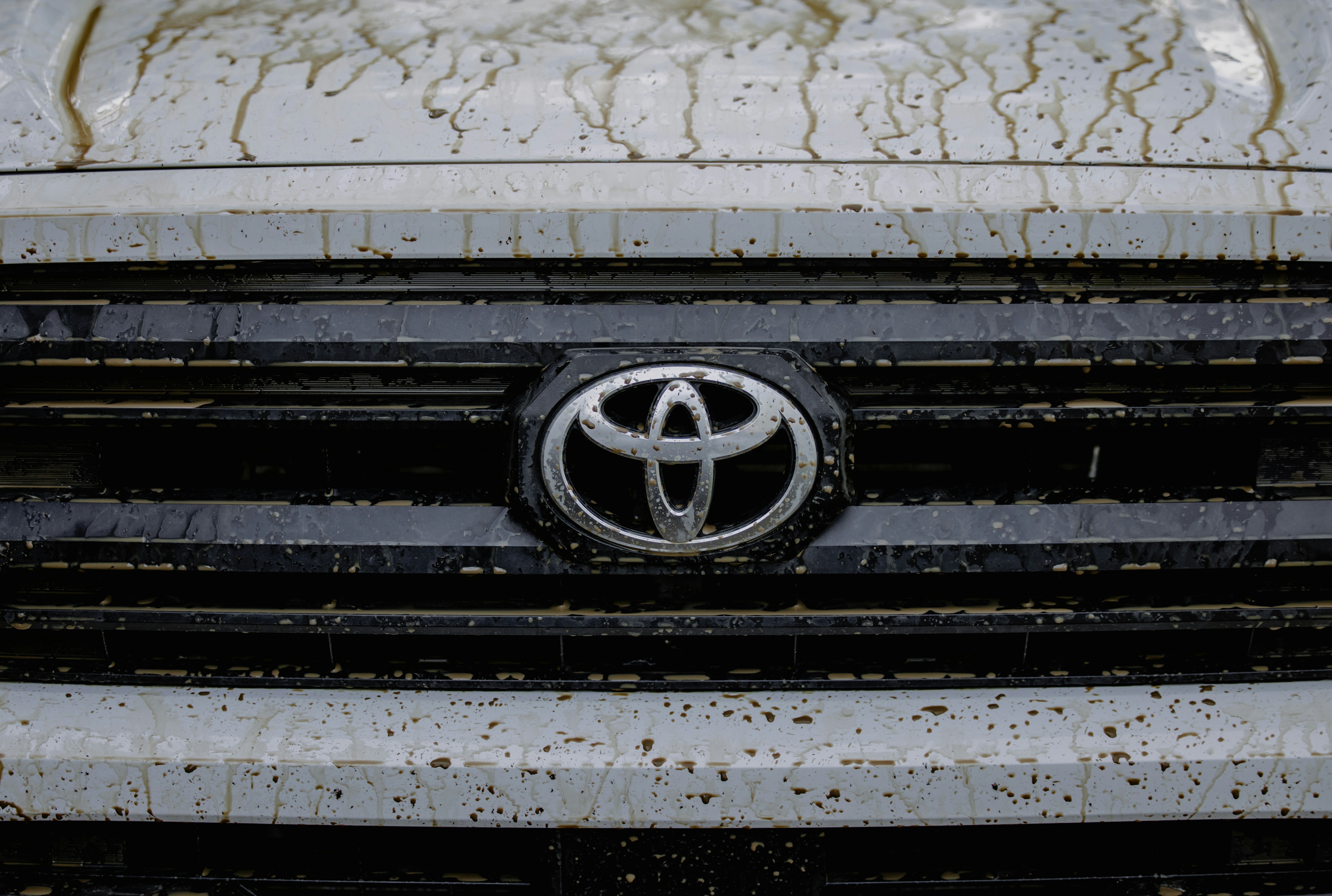 Close-up of a dirty toyota car grille