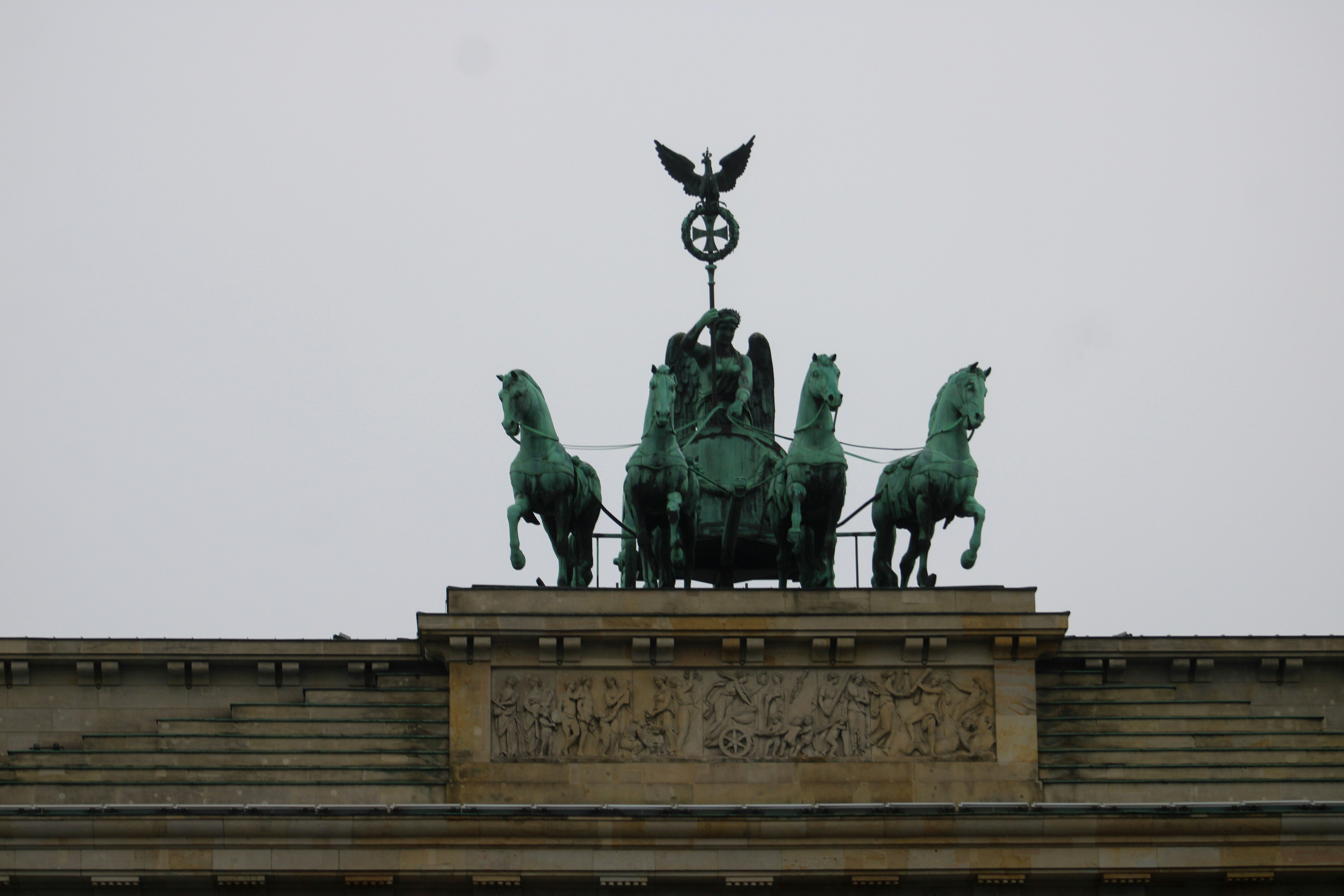Equestrian Triumph: Sculpted Bronze Against a Grey Sky