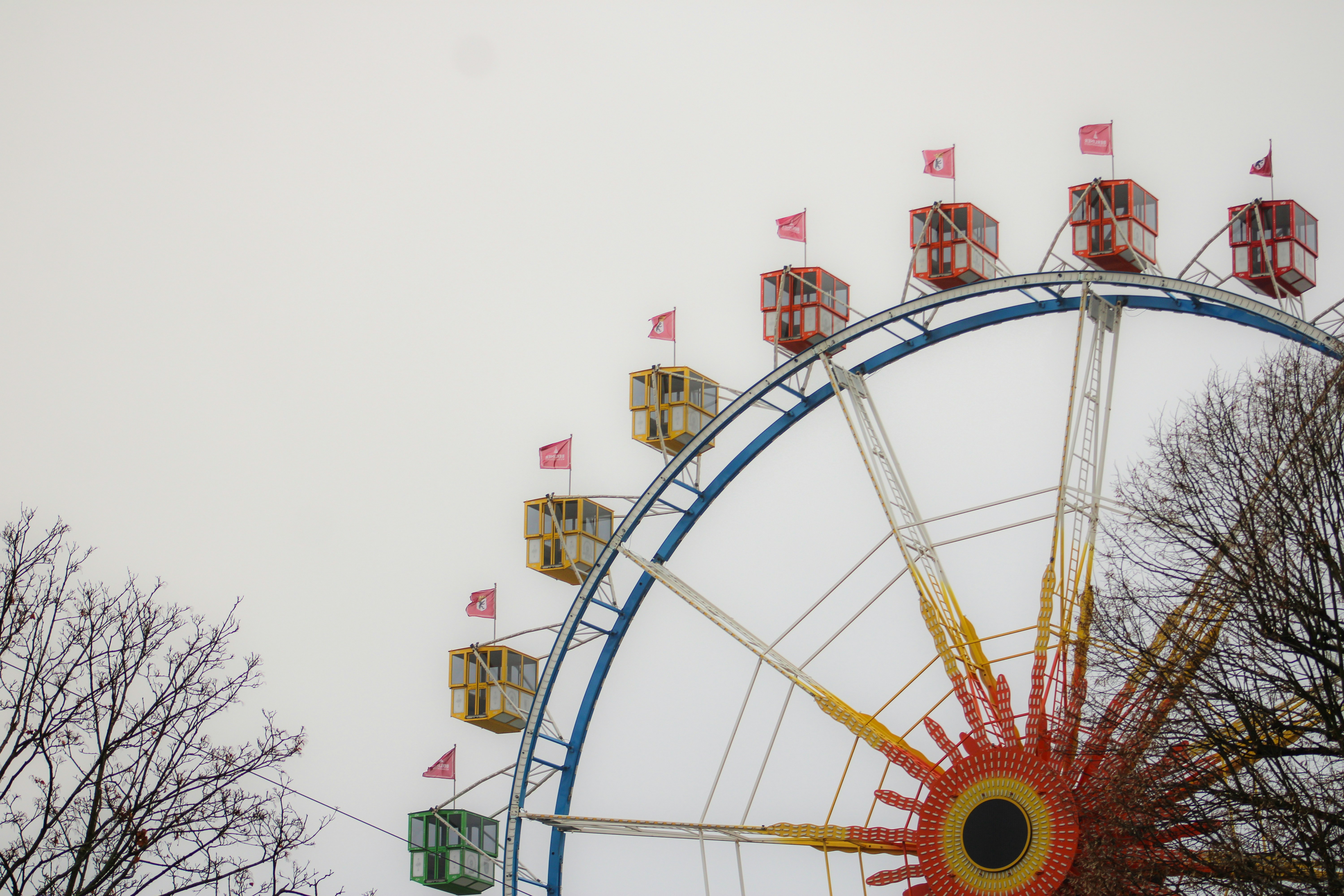 Ferris Wheel Arc: Colorful Spokes at a Winter Afternoon