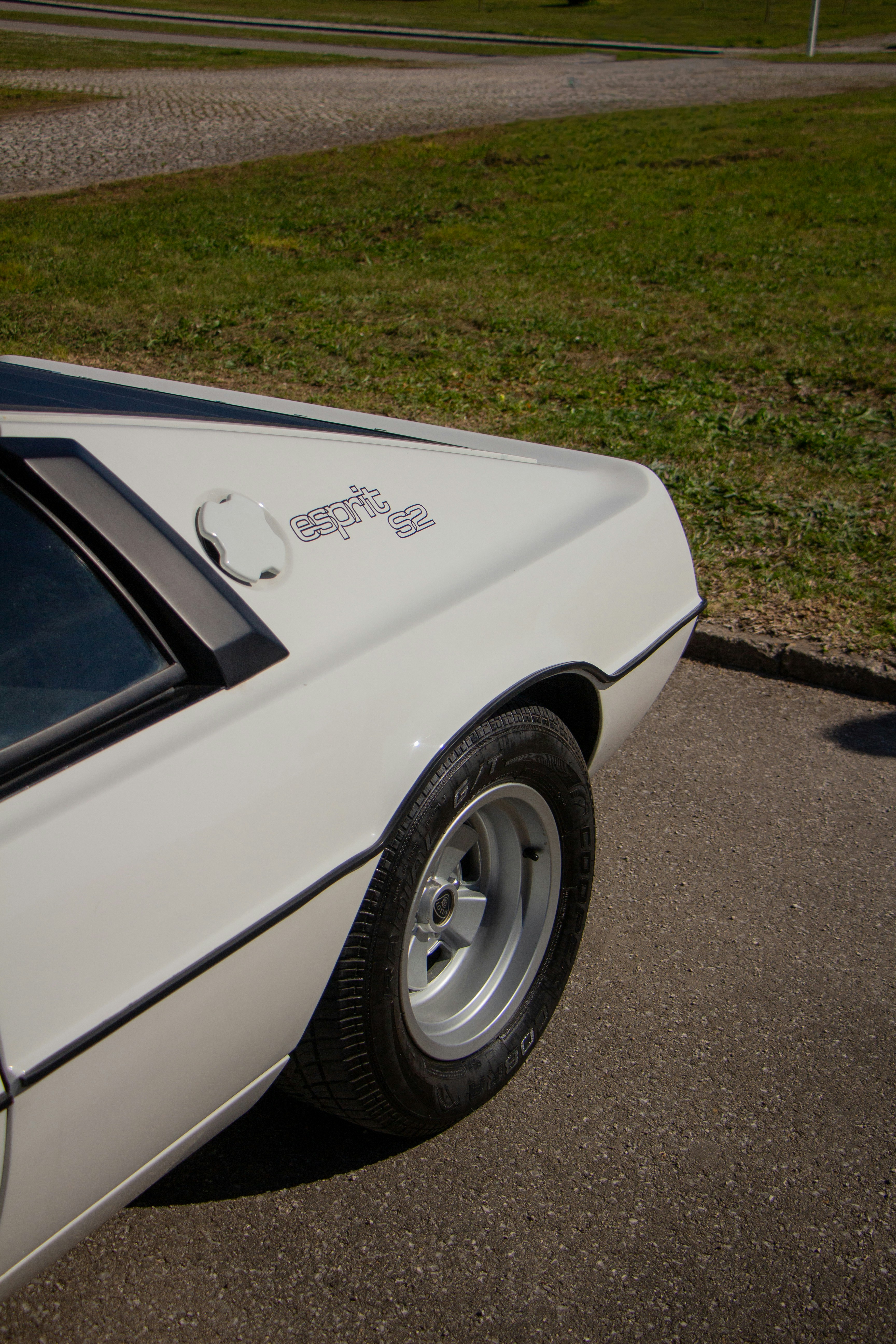 White Dented Classic: The Tail of an Espirit Rear Car in Morning Light