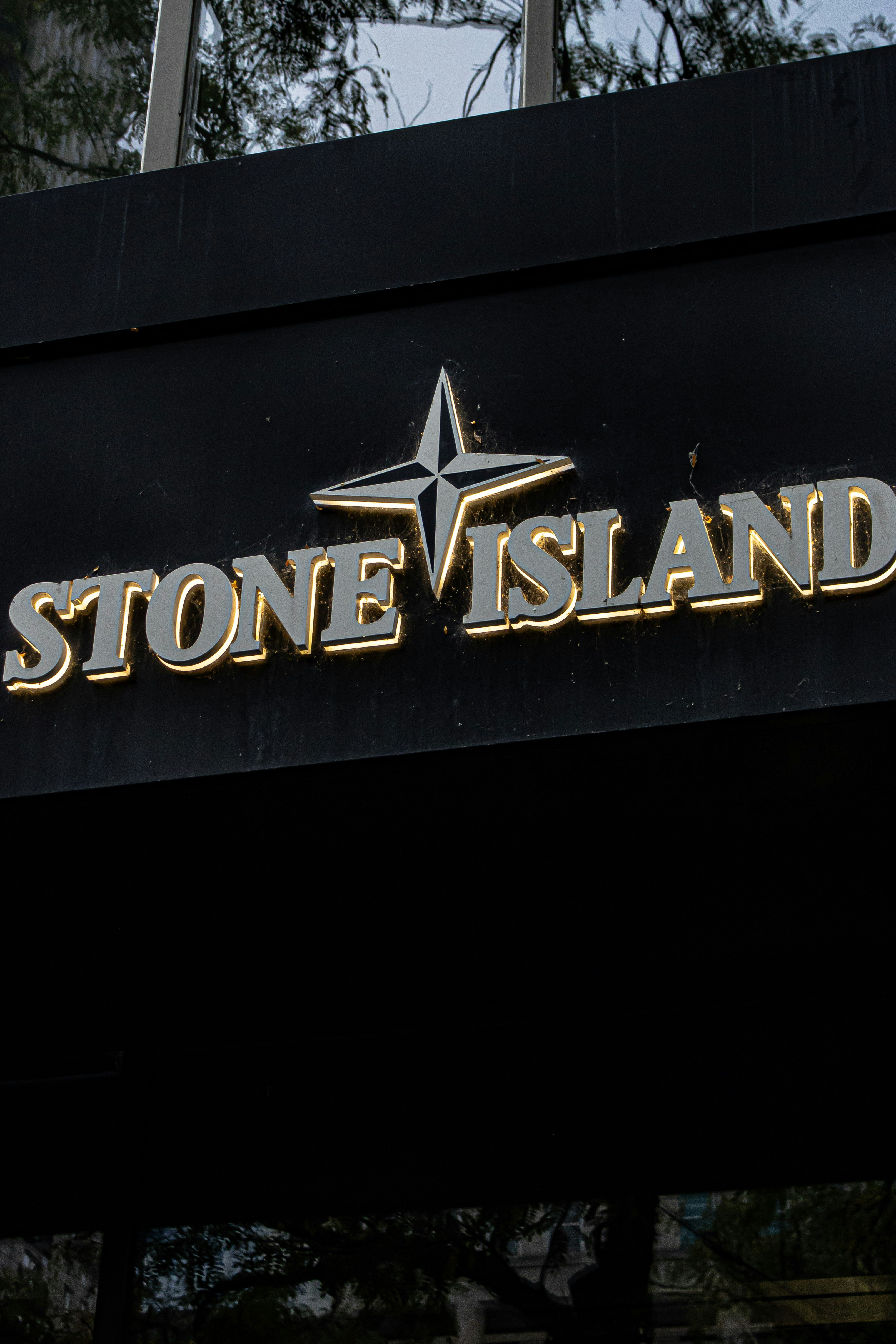 Stone Island Signage in Subdued Golden Glow
