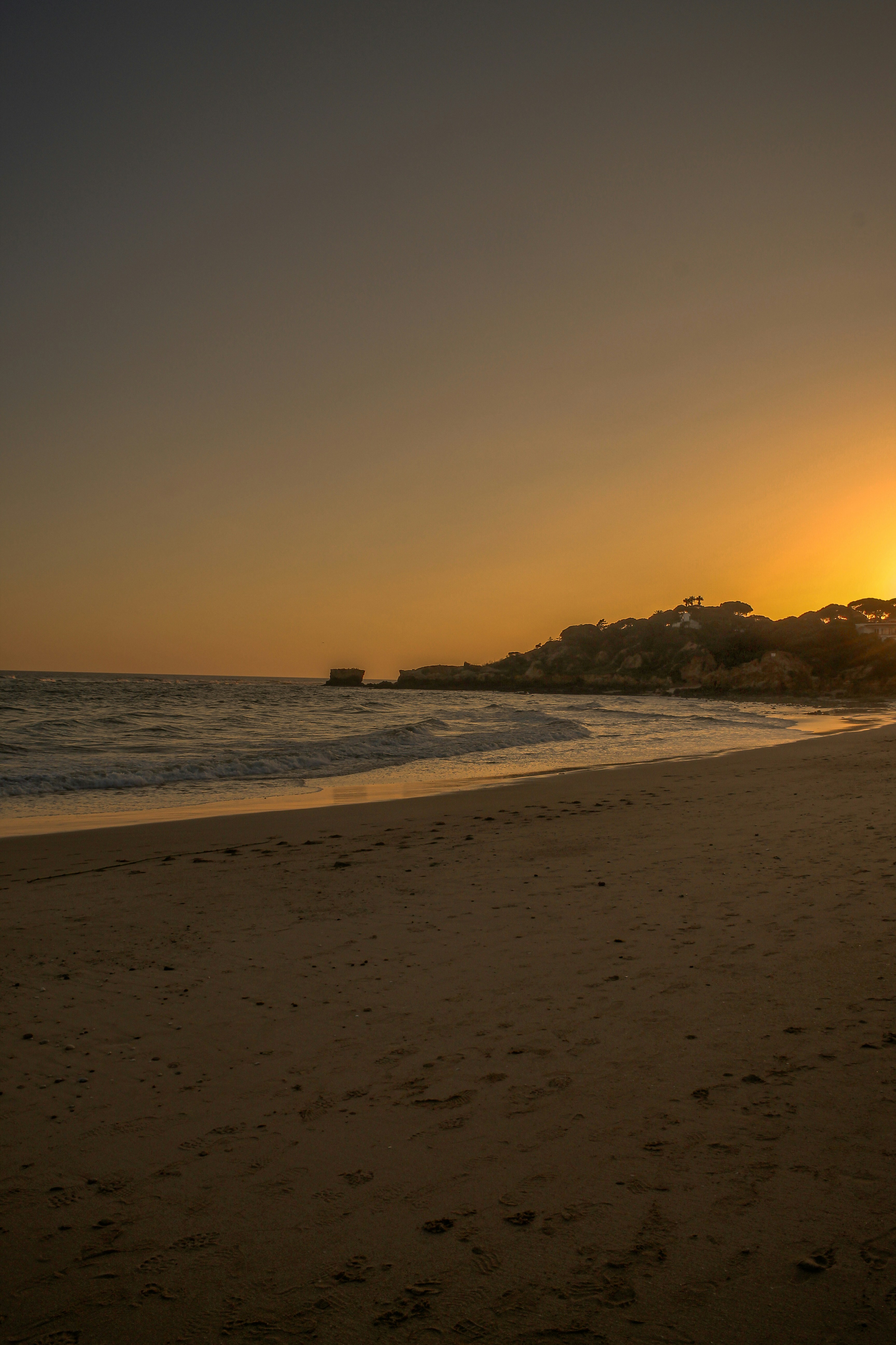 Horizon Glow: Sunset over a Quiet Bay
