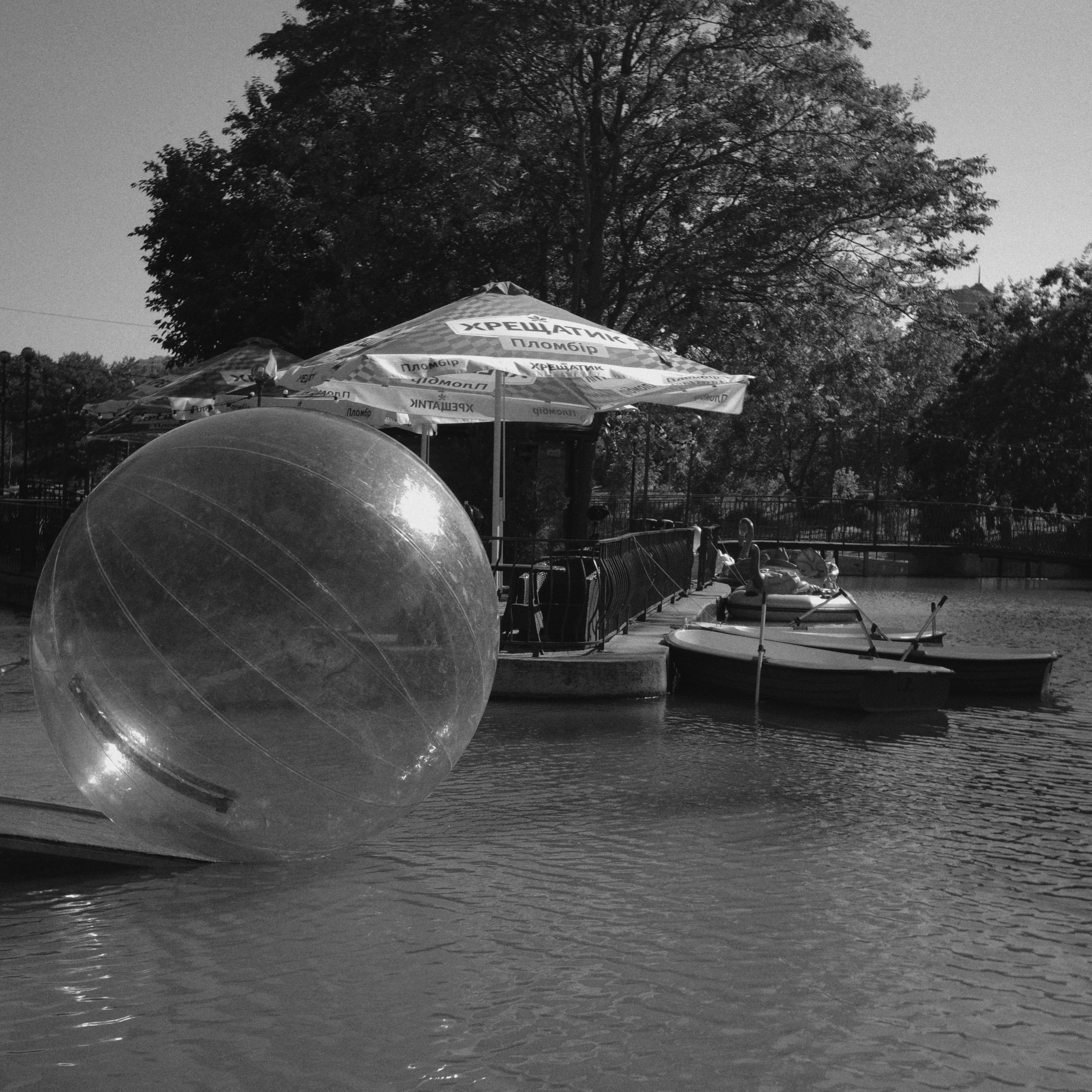 Bubble Ball, Boats, and Shade: A Quiet Park Moment