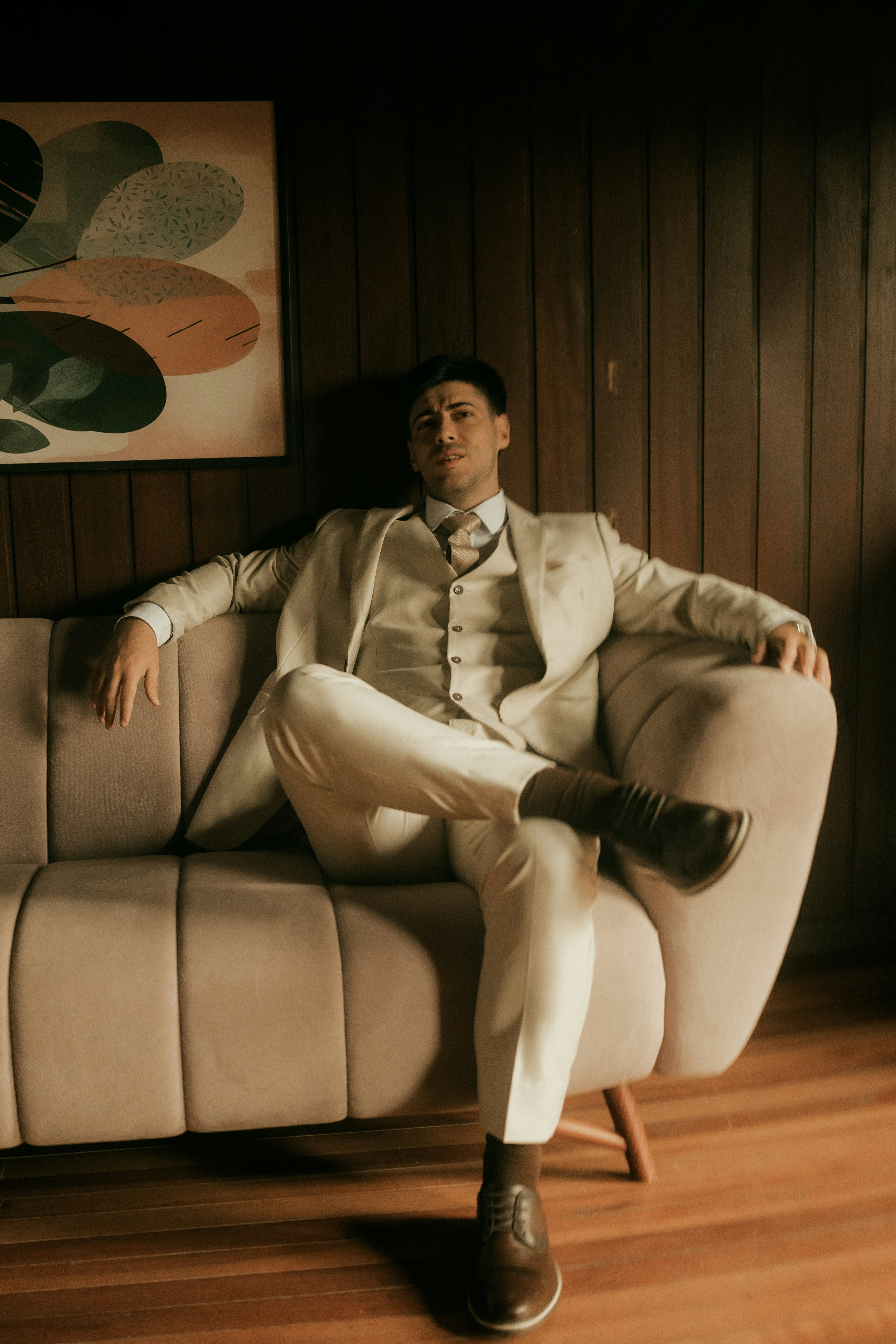 Gentleman in Cream: A Quiet Moment on the Sofa