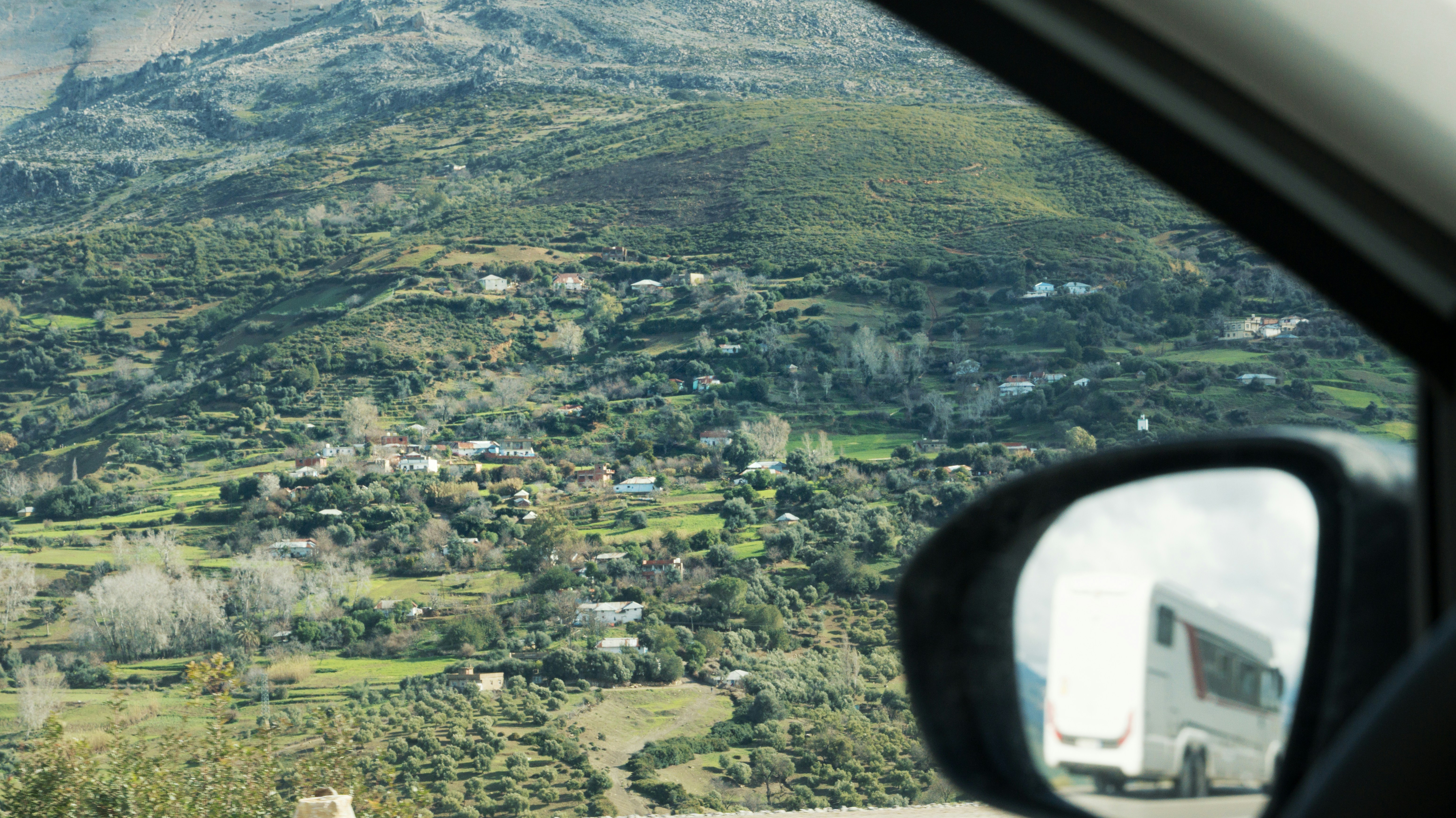 Countryside Valley Window: A Mountain Village Beyond the Car Window