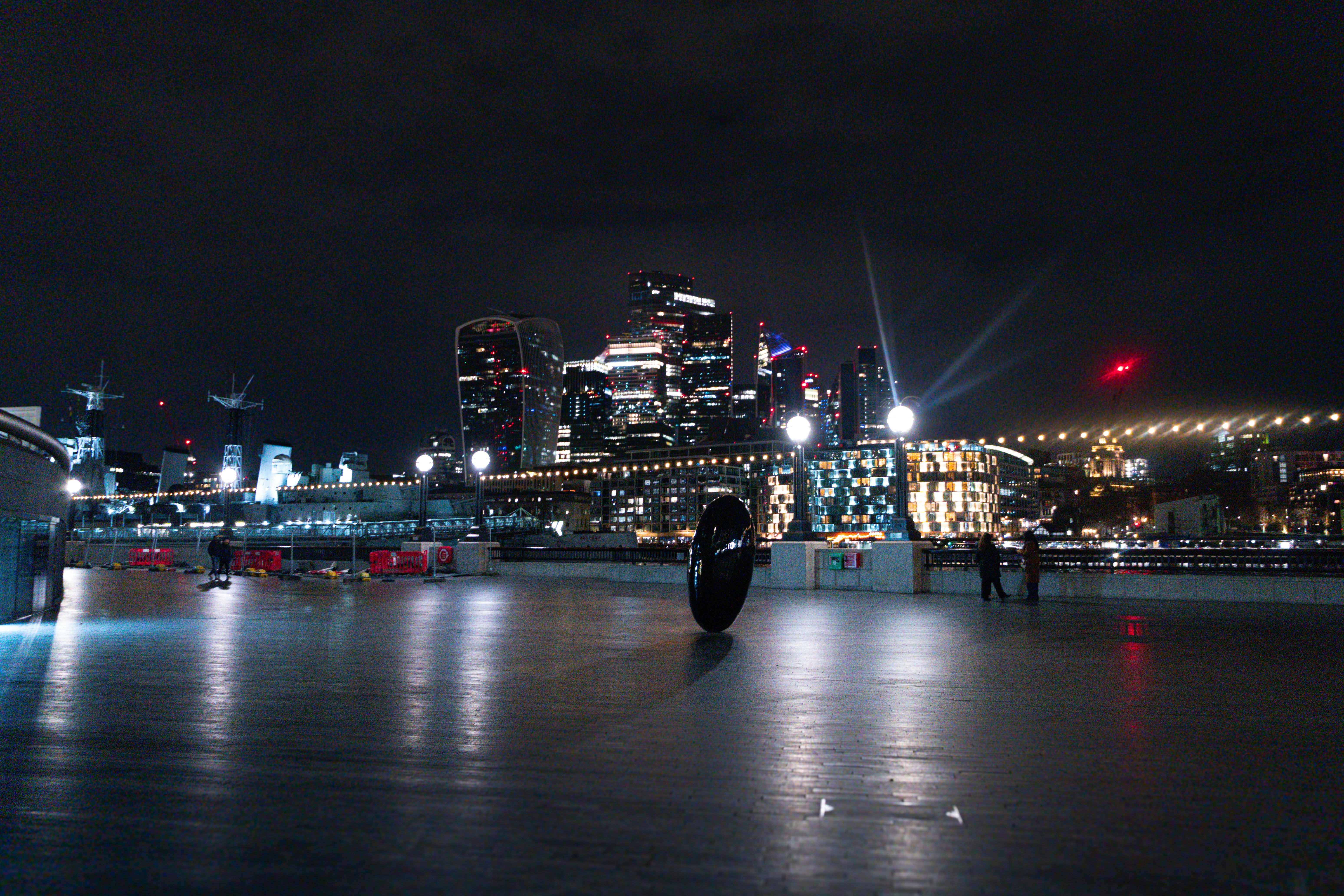 Midnight Wharf: Wheel and Skyline in Neon Light