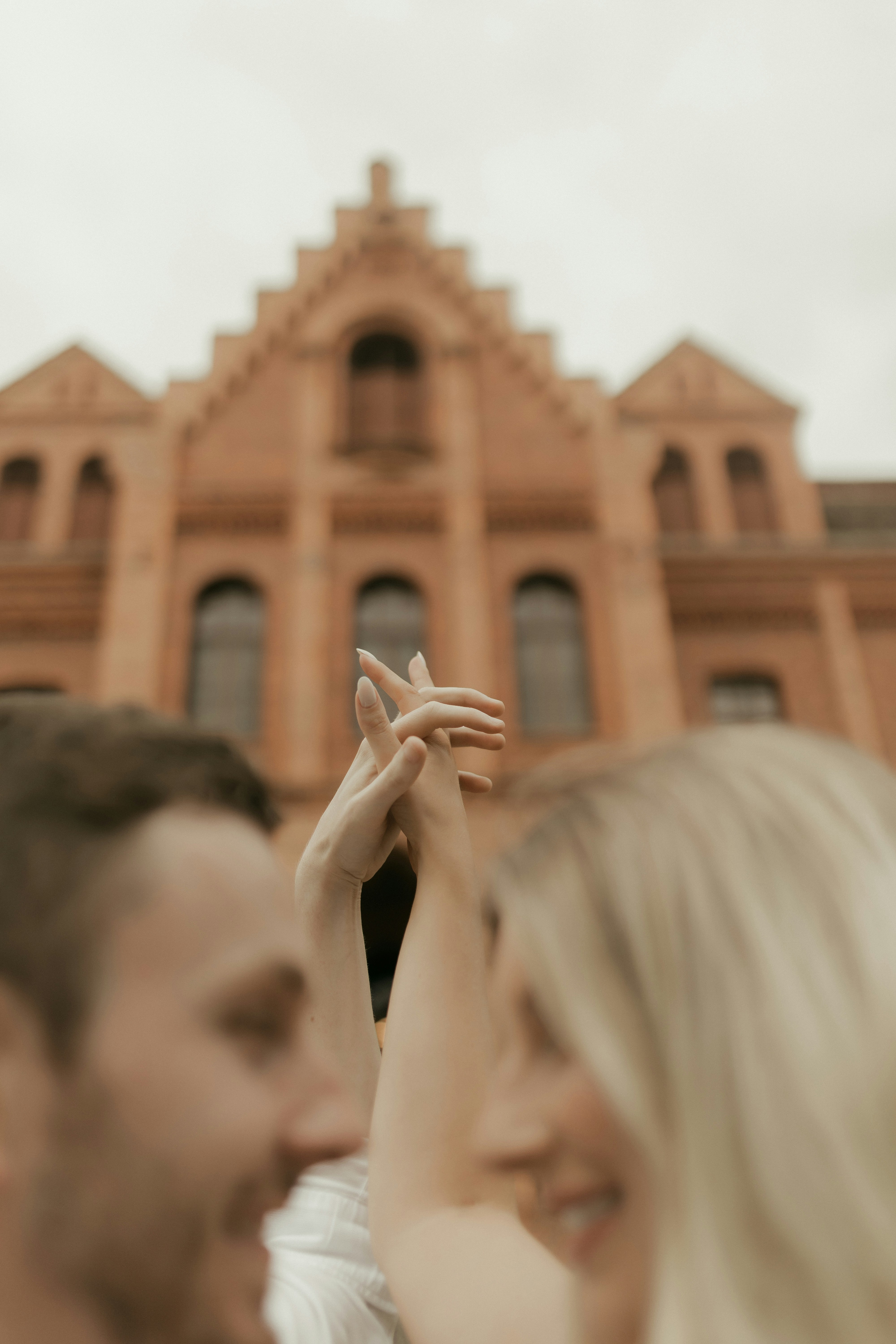 Handshake Above the Brick Facade