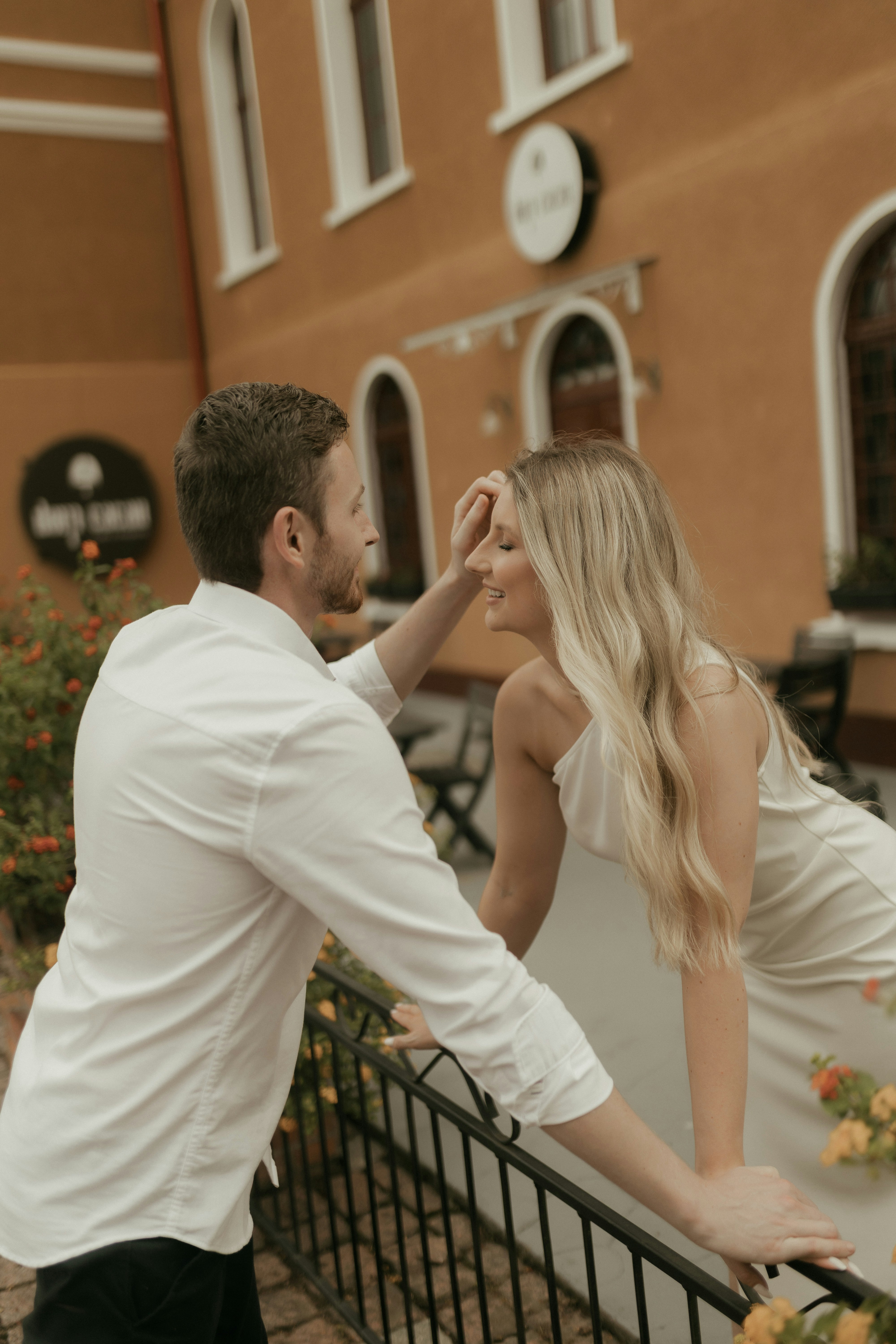 Tender Moment on a Sunlit Terrace