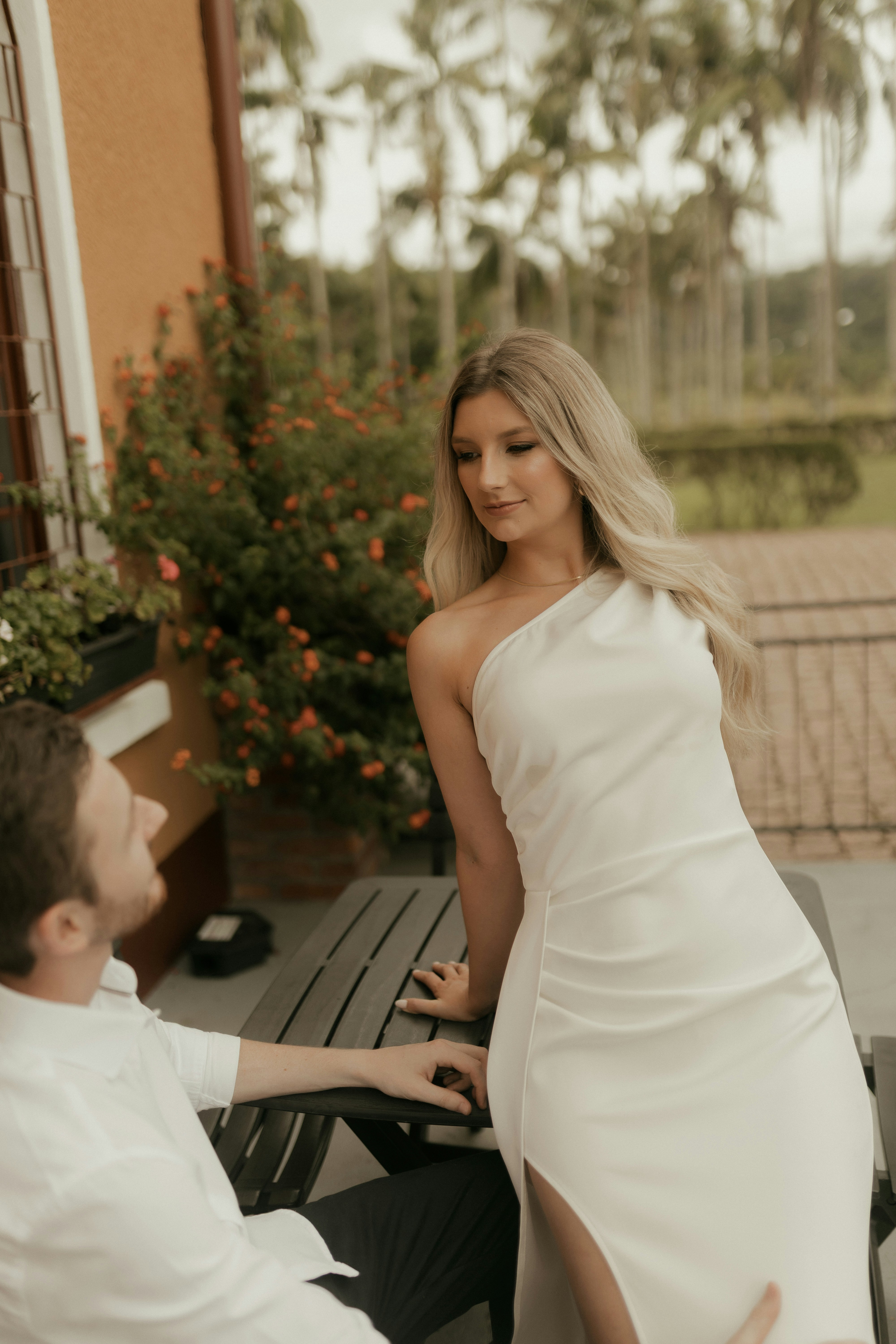 Elegance on the Terrace: A Quiet Moment Between Two