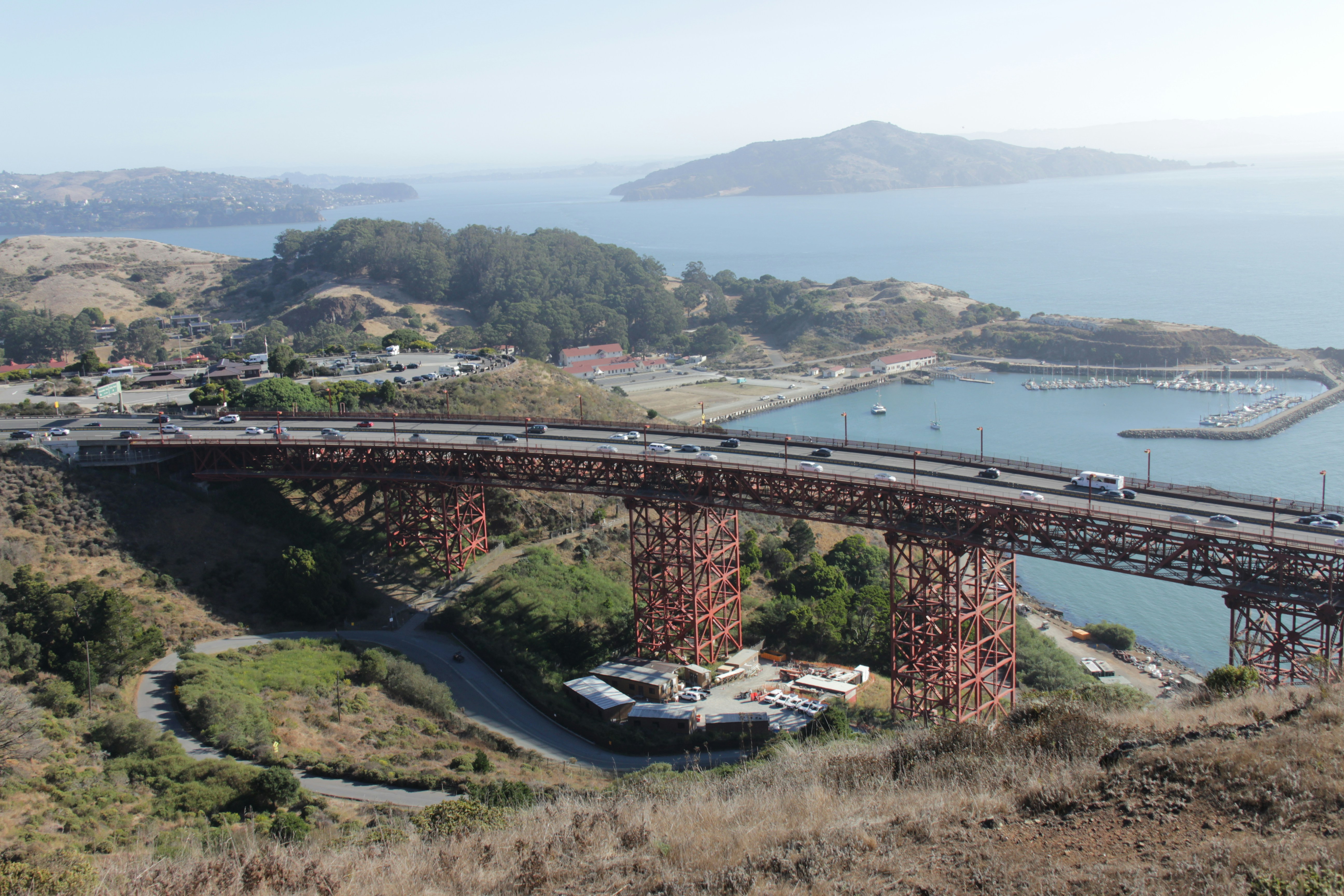 Bridge over the hillside harbor: rusty steel spans and coastal panorama