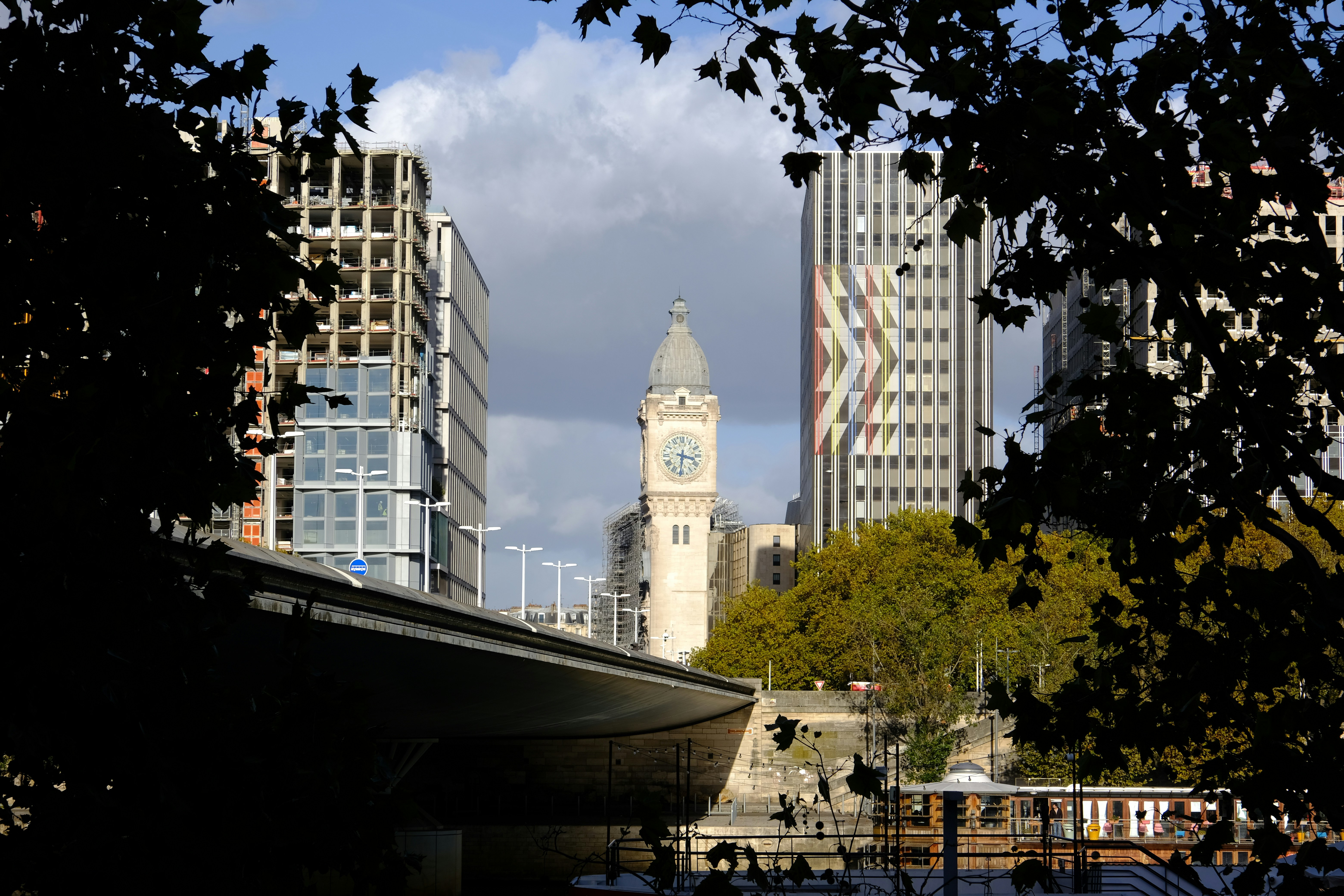 Clocktower Rising Between Modern Facades