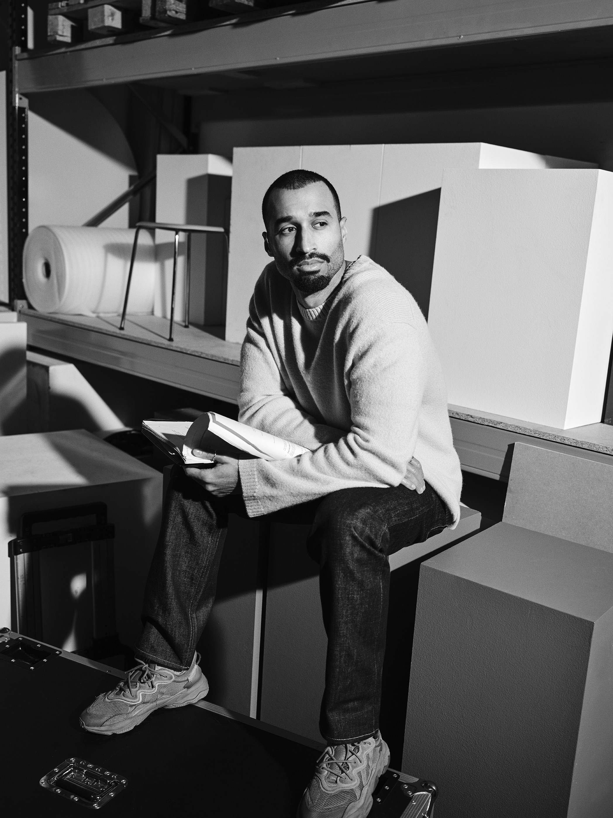 Studio quietude: a thoughtful portrait among geometric echoes