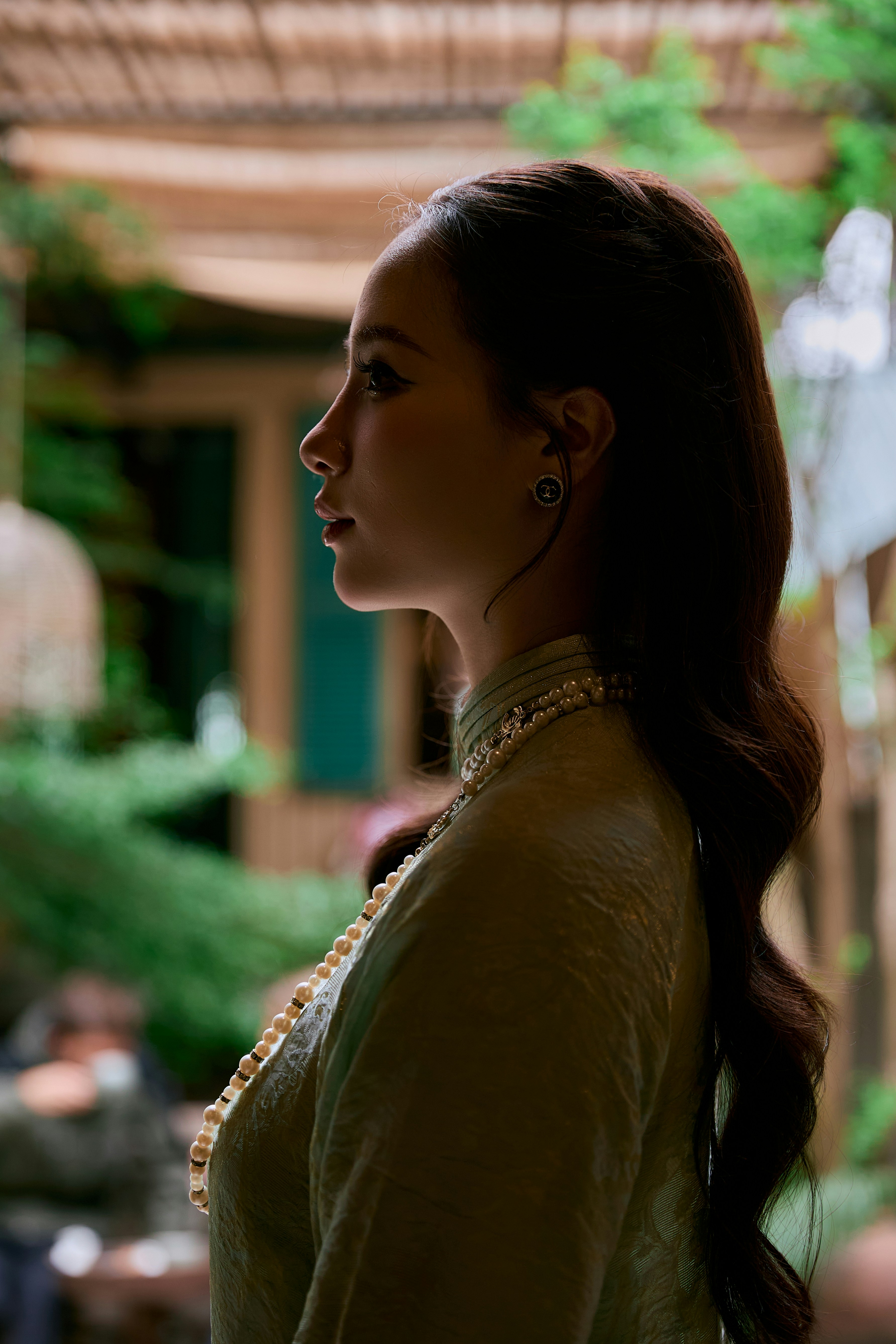 Silhouette of Grace: a profile beneath warm ambient light