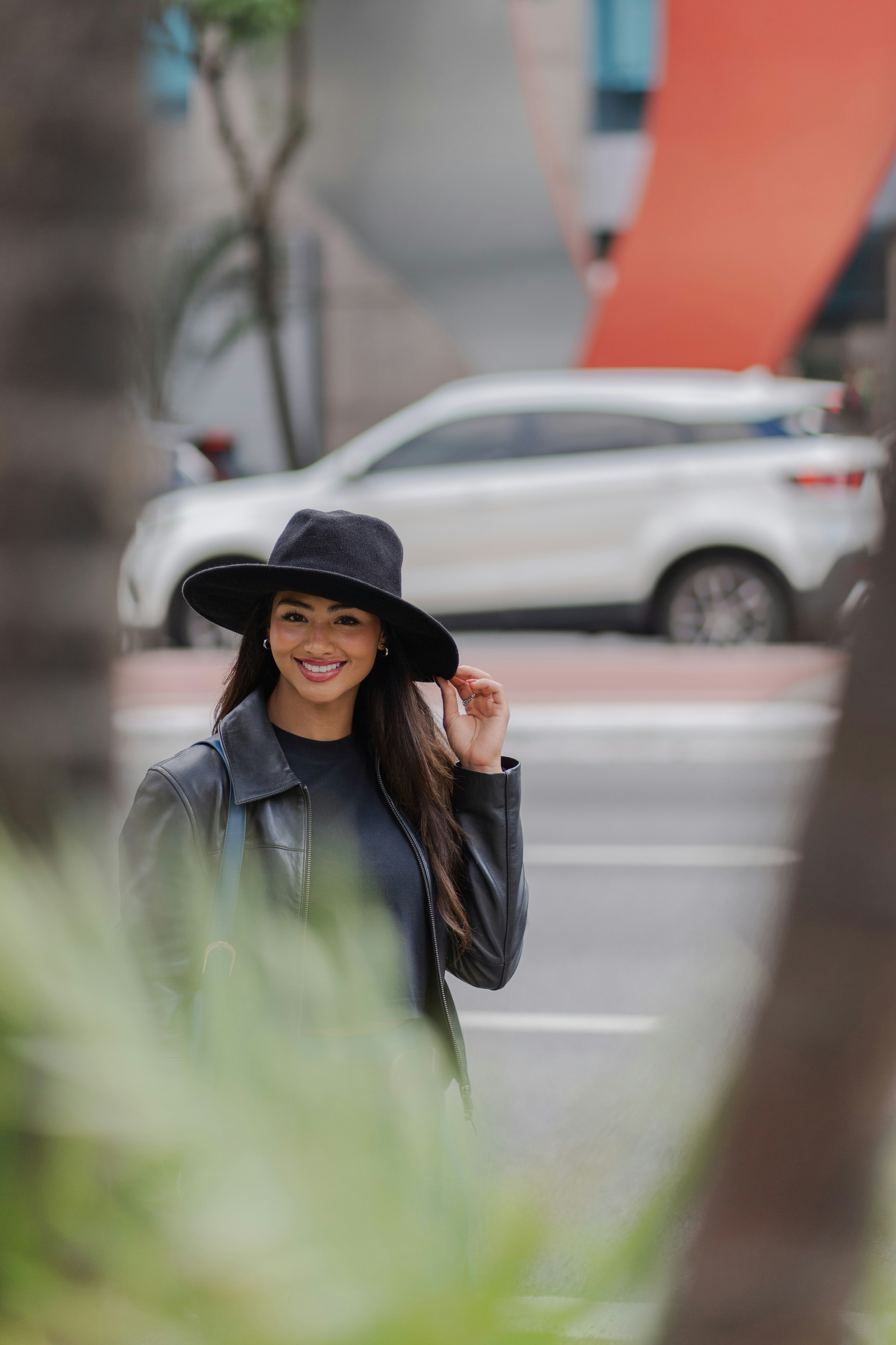 Wide-Frame Portrait of a Woman in a Black Hat