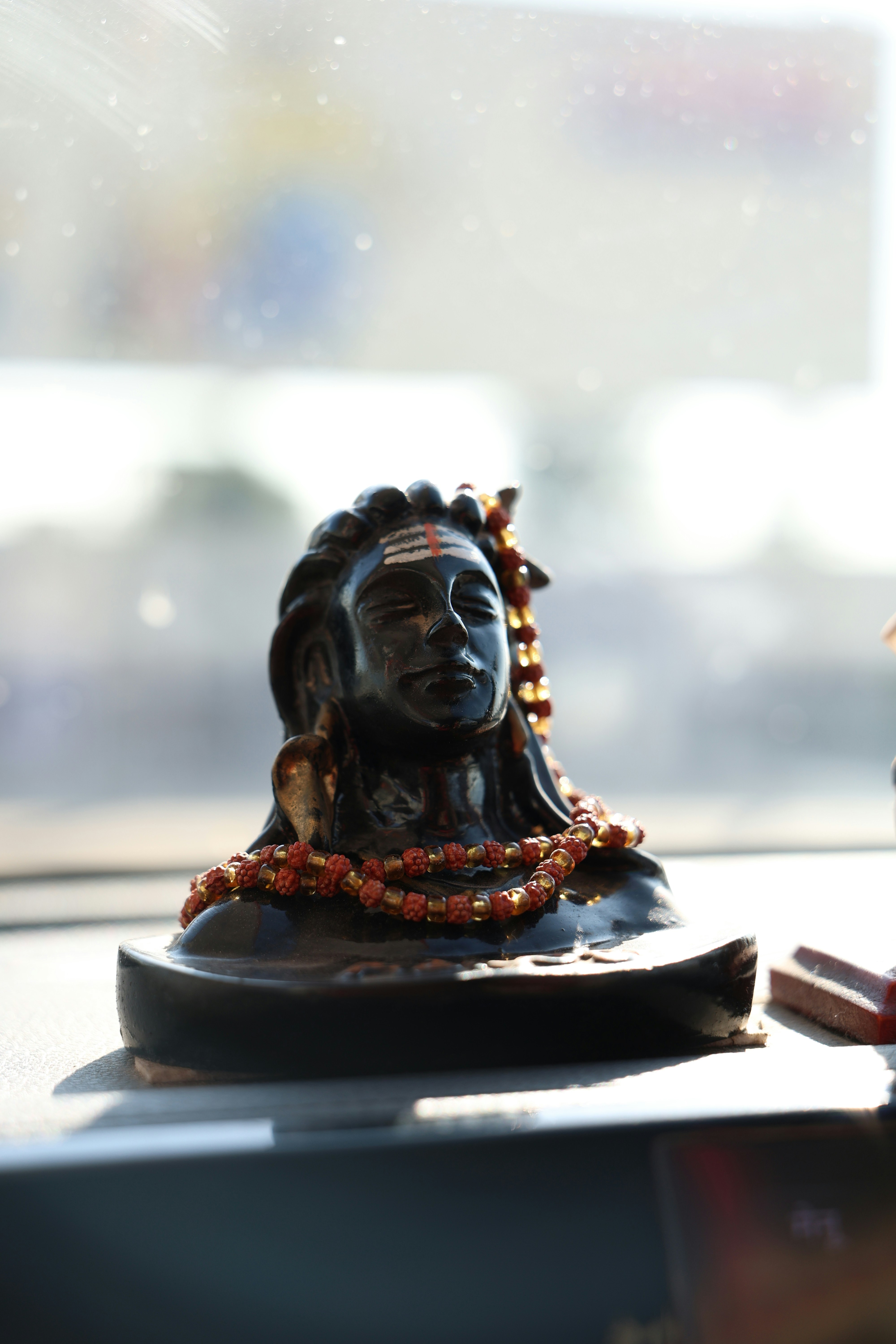 Beaded Reverie: The Dark Idol on a Sung-Glass Window
