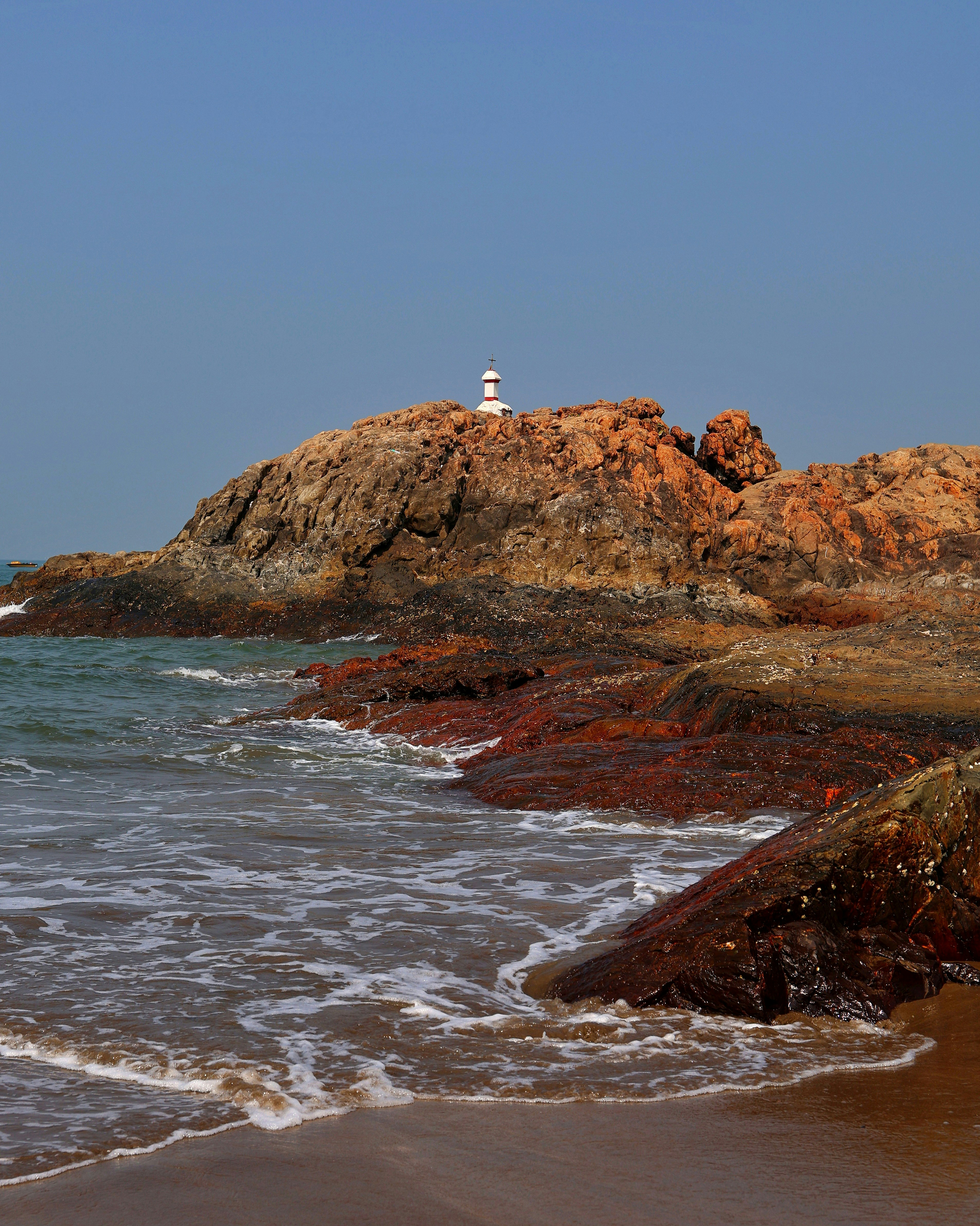Lighthouse on the Rugged Shore