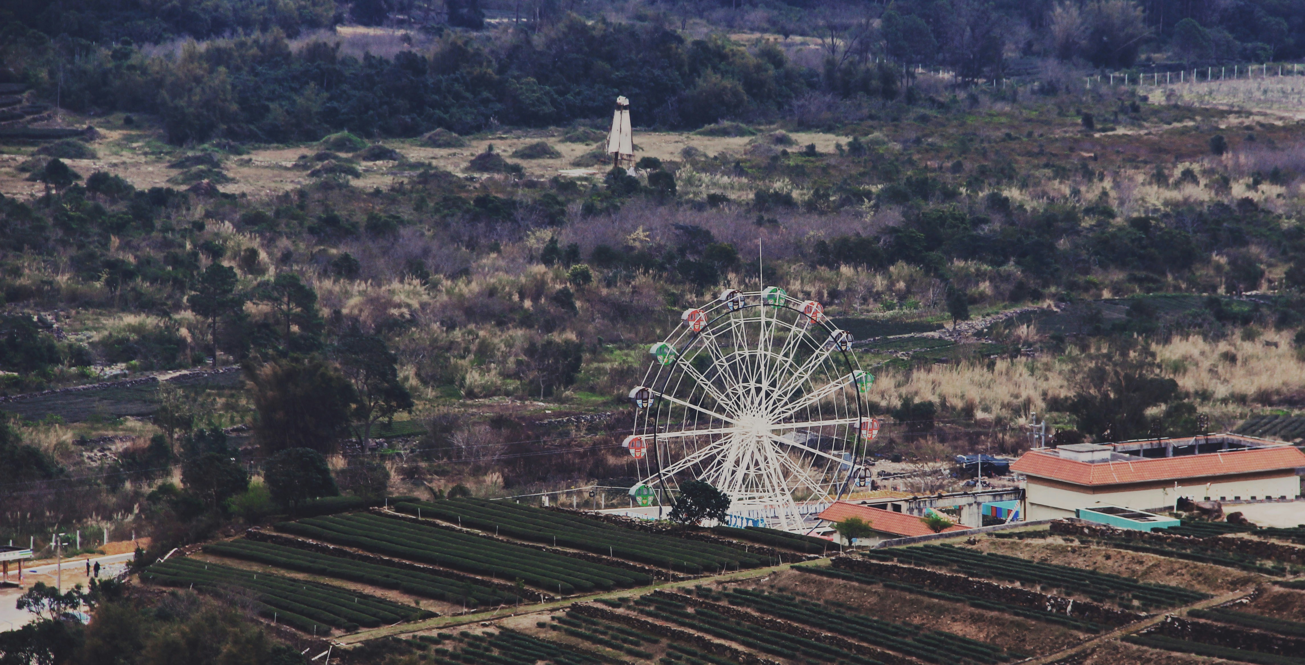 Ferris Wheel on the Hill: A Quiet Fairground Above Terraced Fields