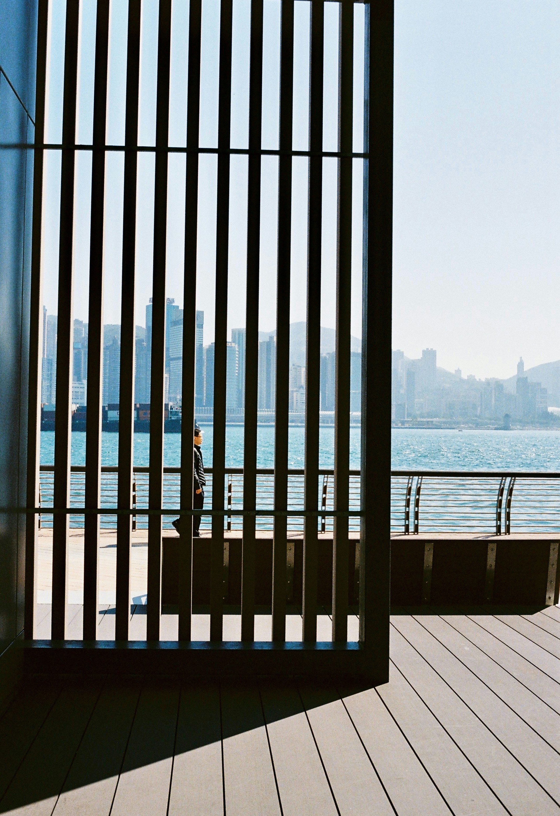 Sunlit Pier Through Vertical Slats