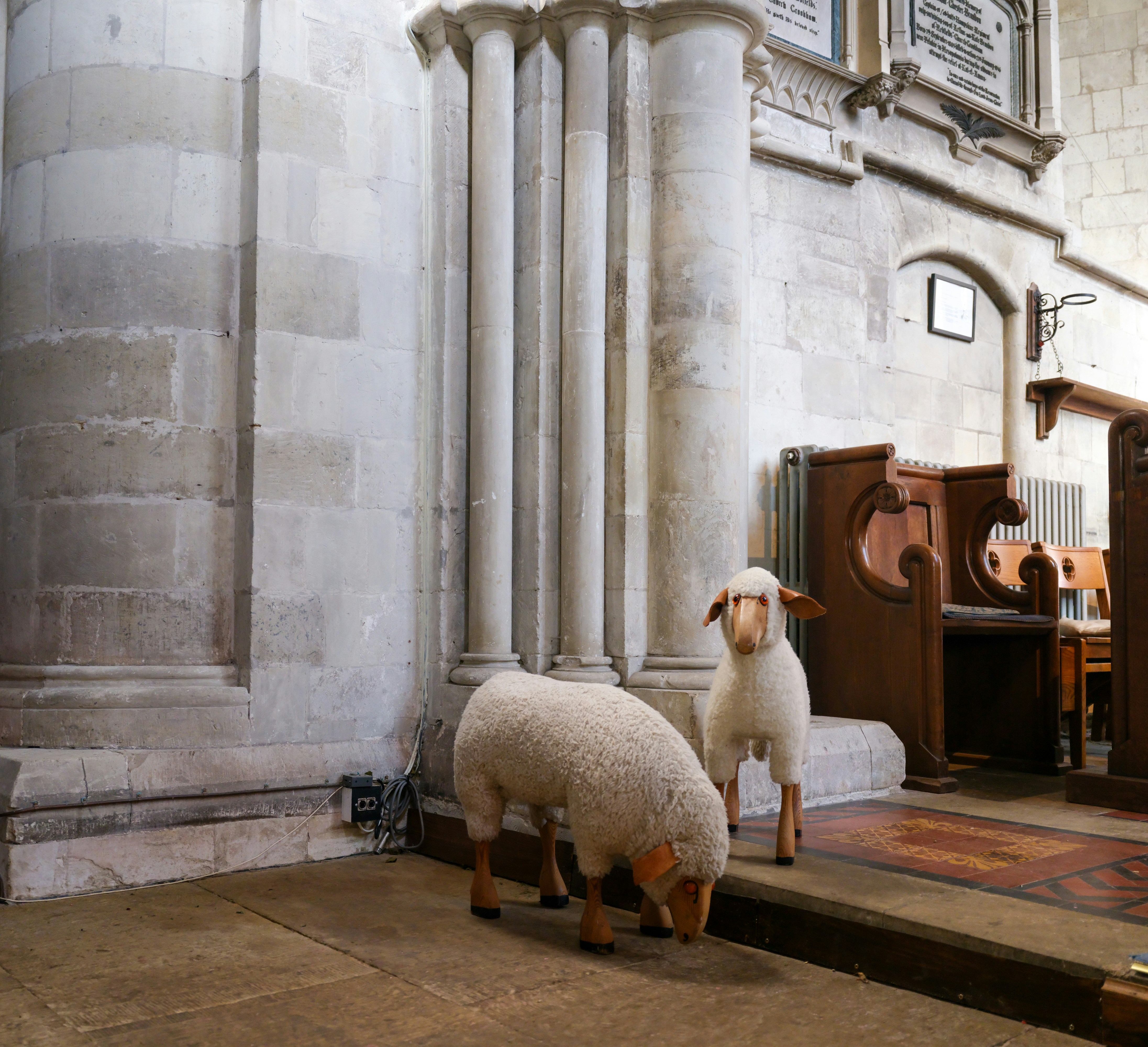 Cathedral Porch: Sheep at Rest Beneath Arched Pillars