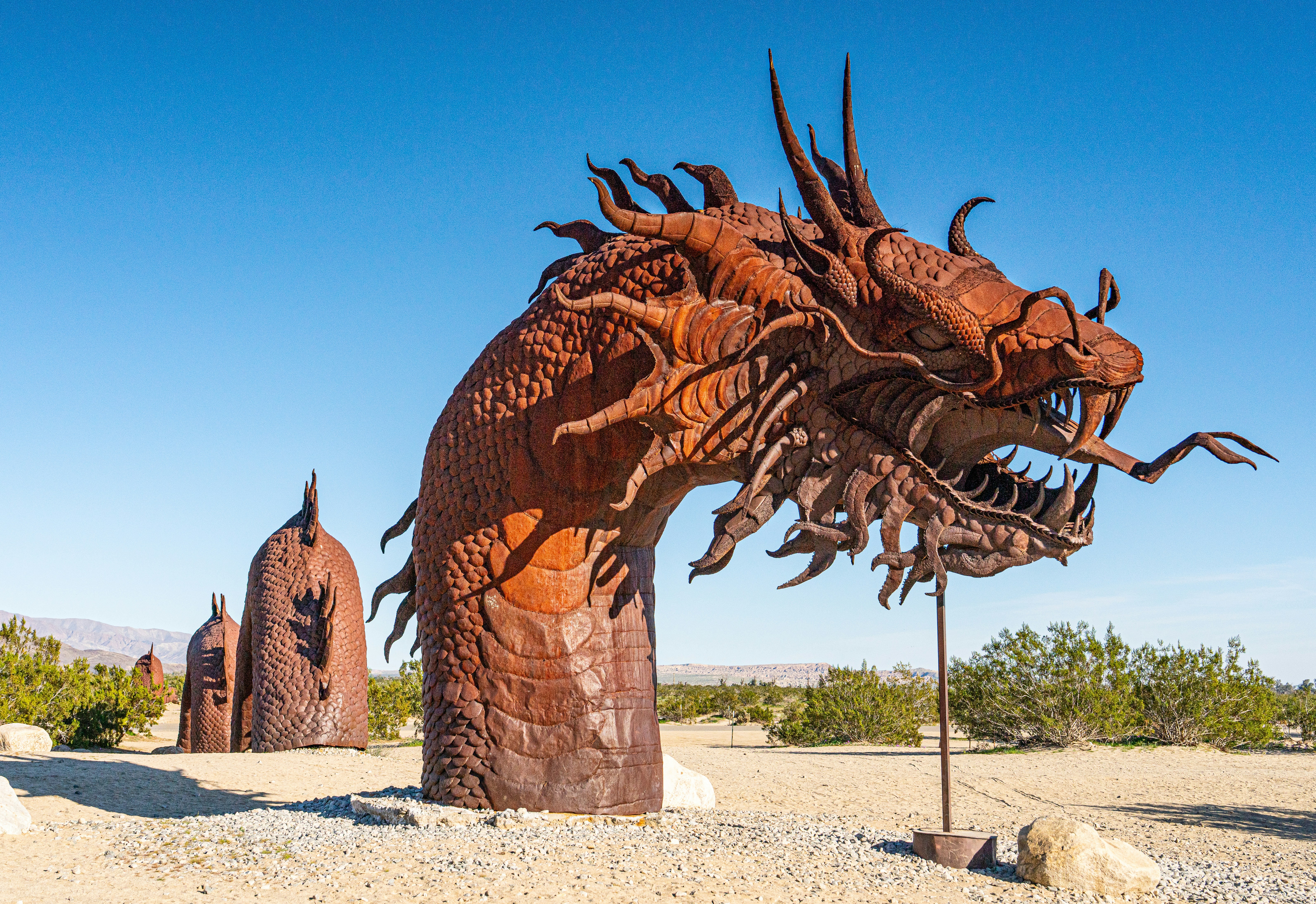 Iron Serpent of the Desert: Sculpted Dragon Among Dunes