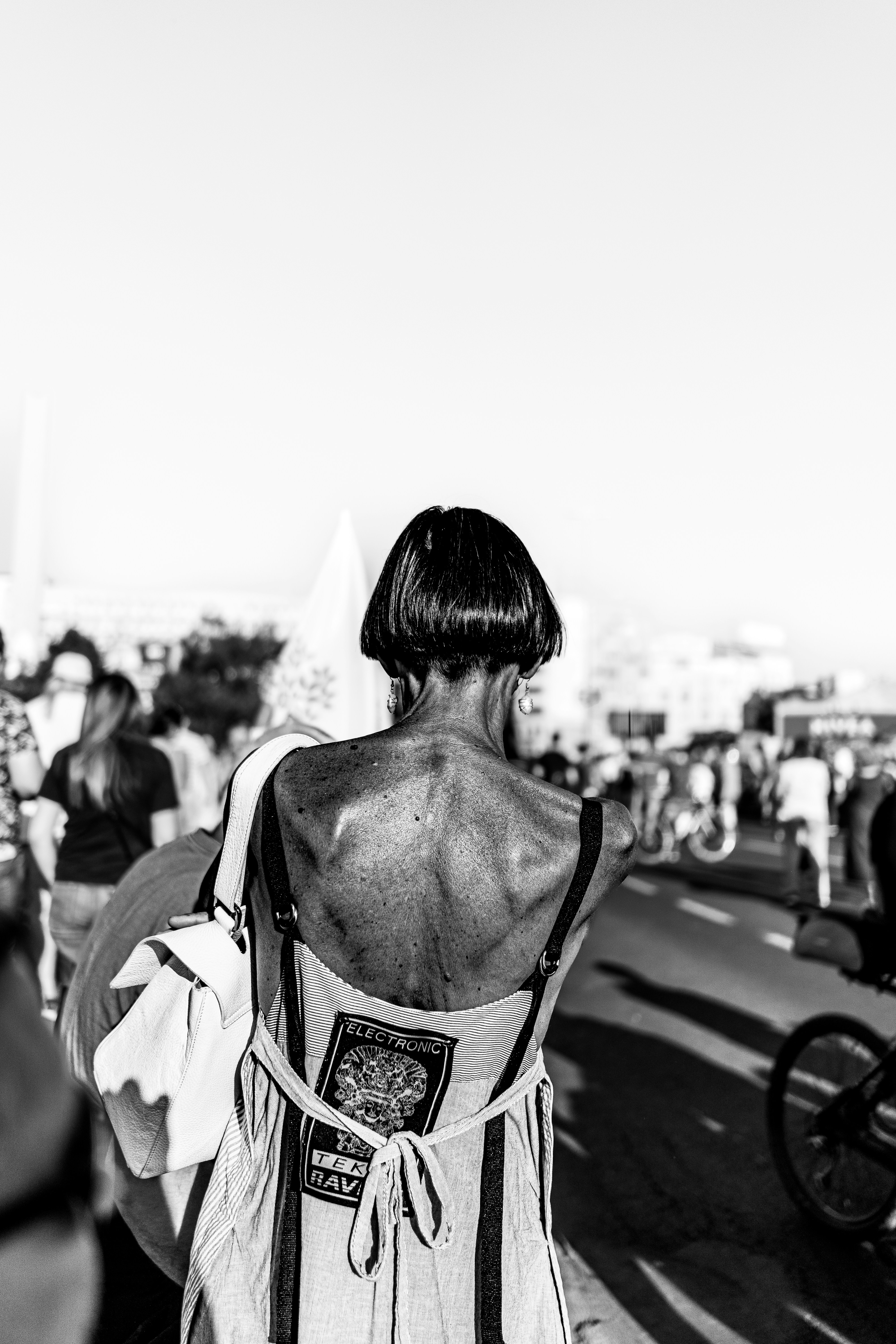 Back to the Crowd: A Portrait of Quiet Strength Amid the Parade