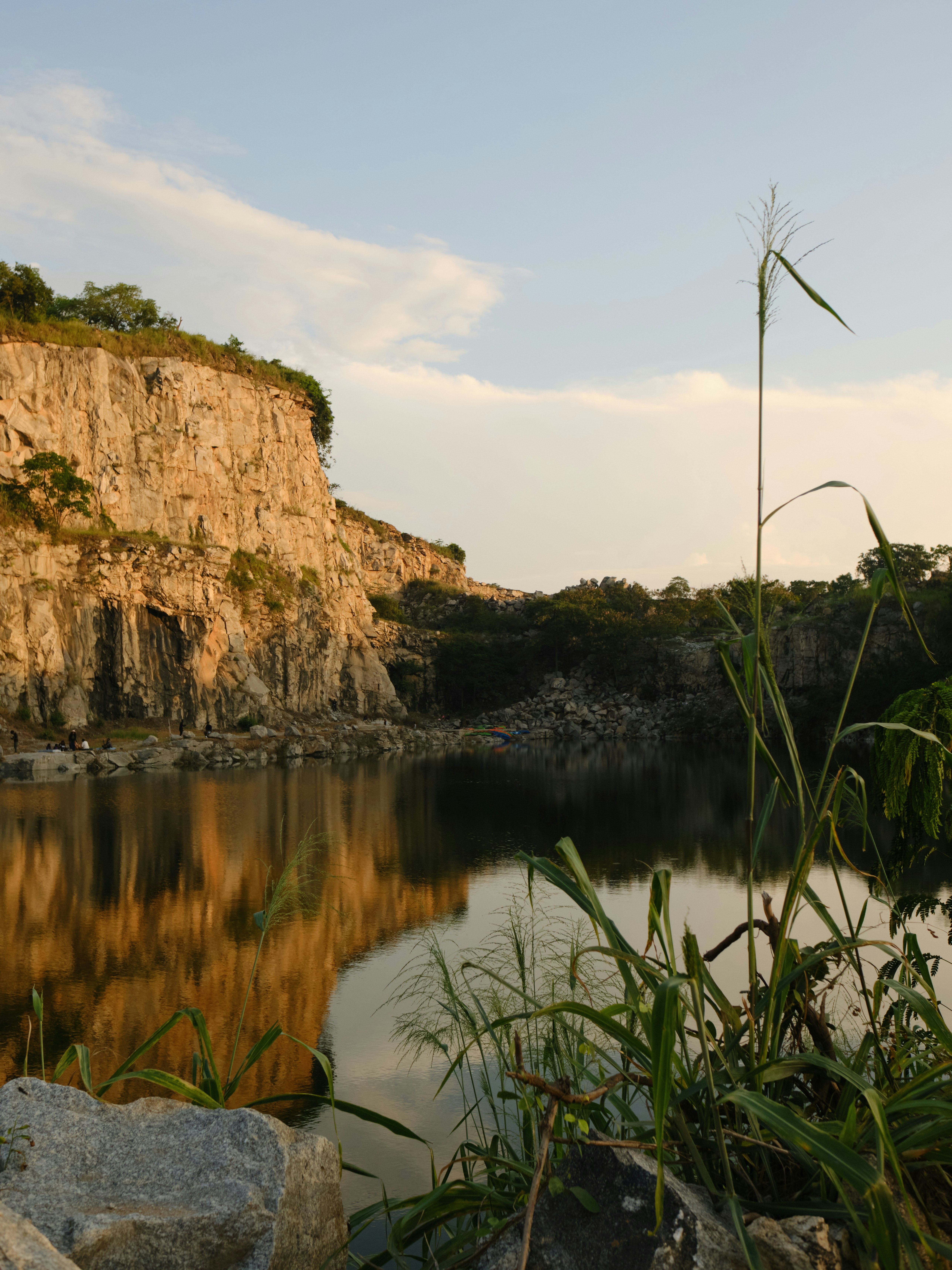 Cliffside Mirror: Quiet River Reflections at Dusk