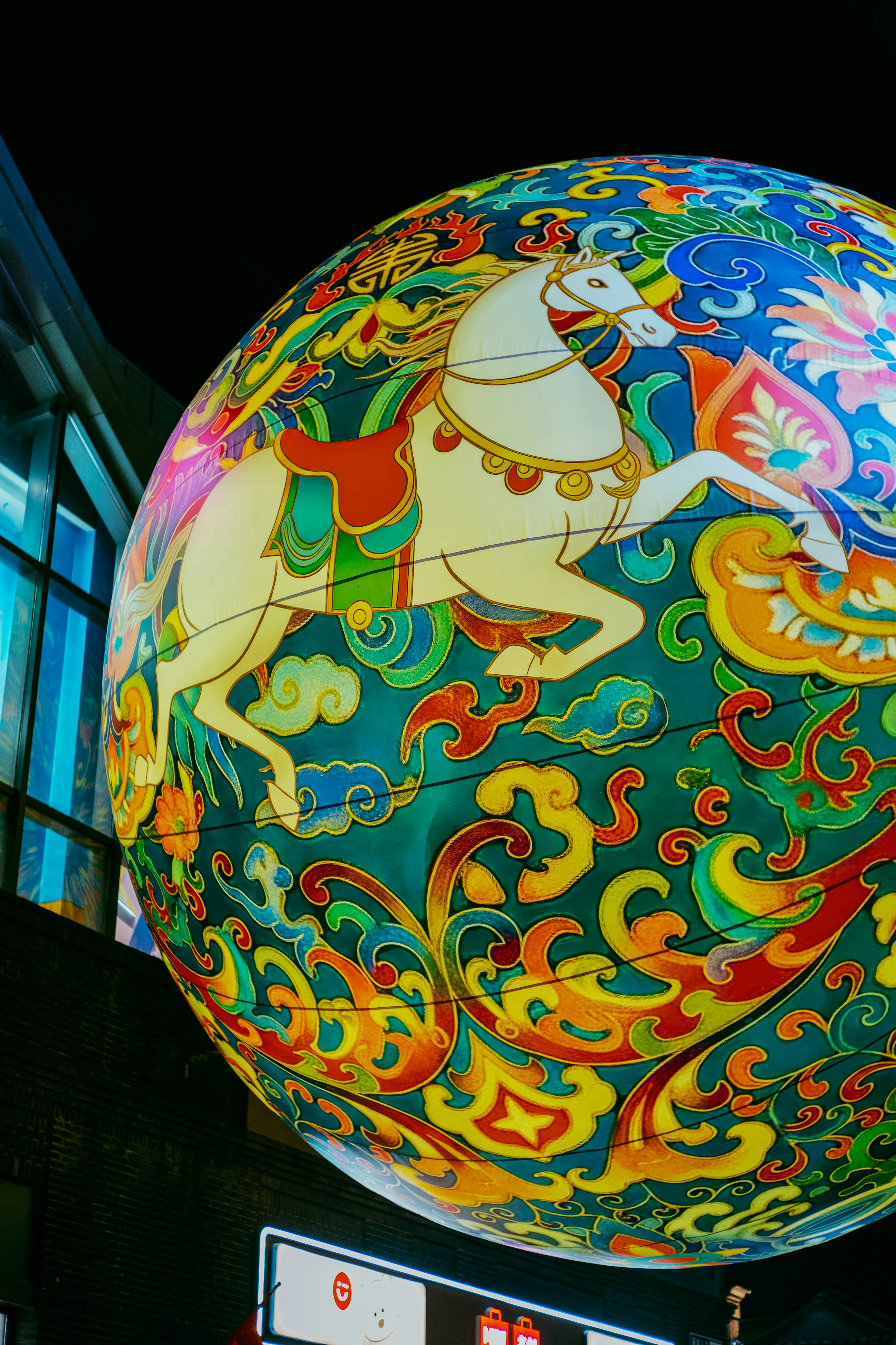 Colorful Orb: A Neon Horse Surges Across A Painted Sphere