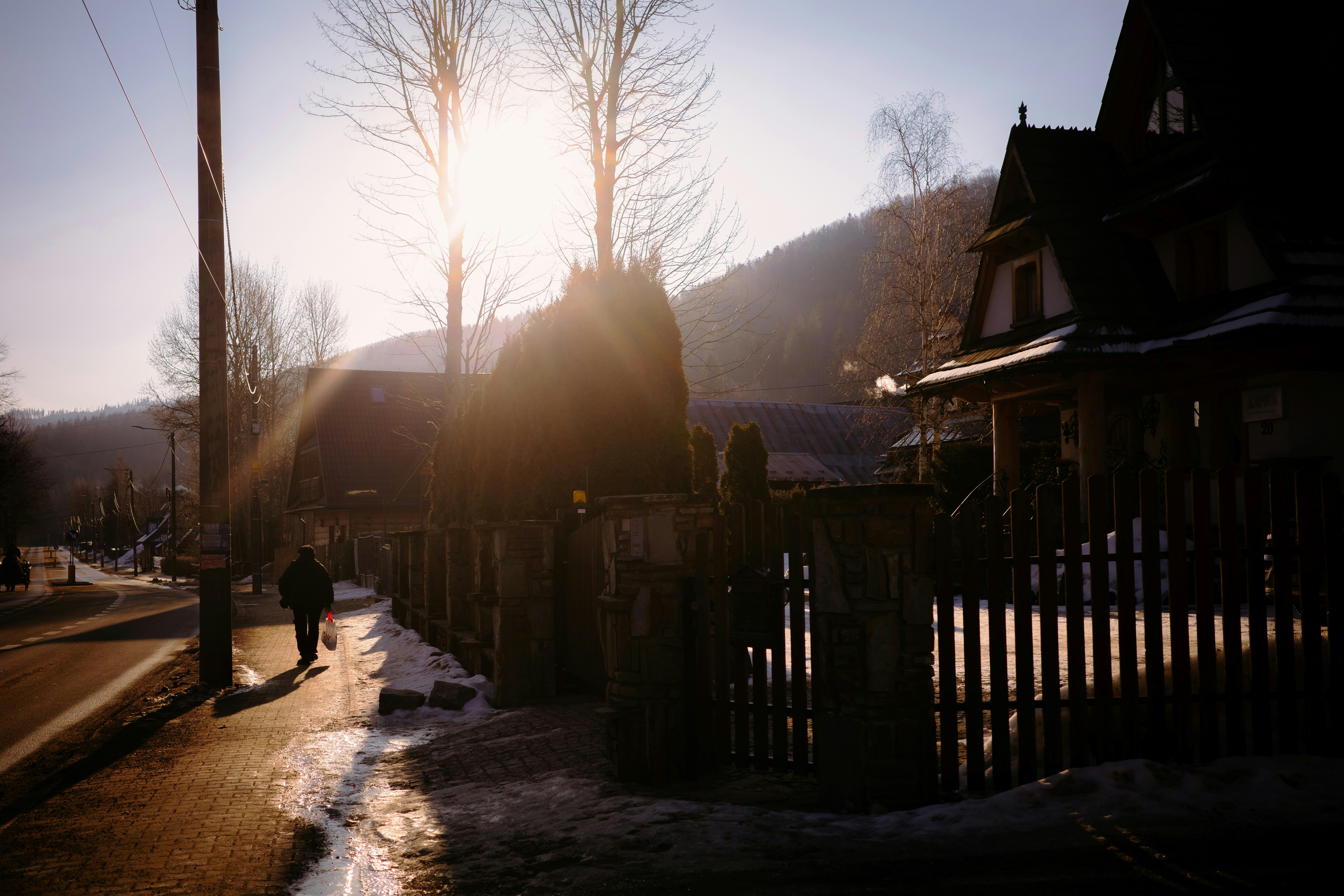 Sunlit Silence on a Snow-Edge Street