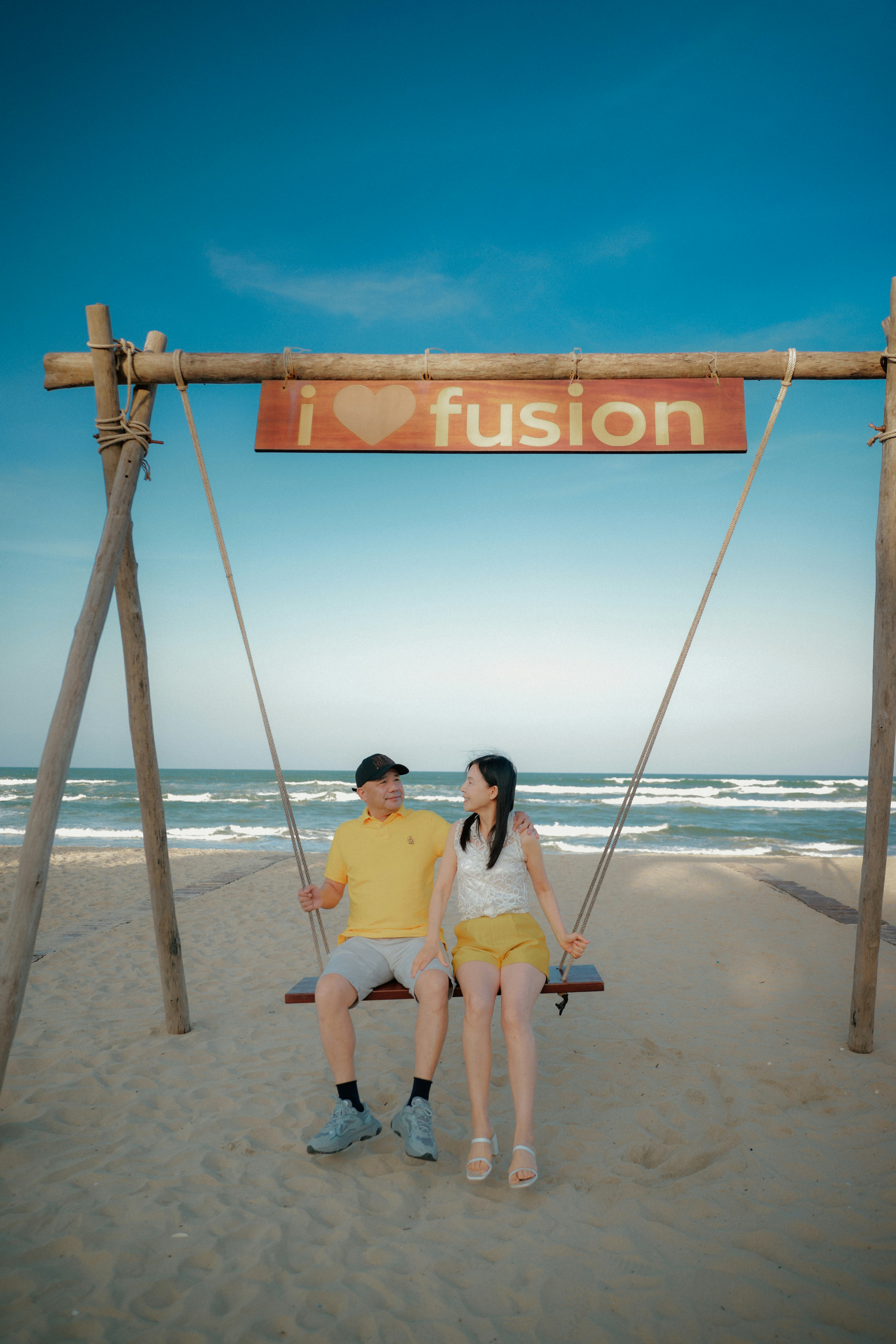 Sunlit Love on the Beach Swing