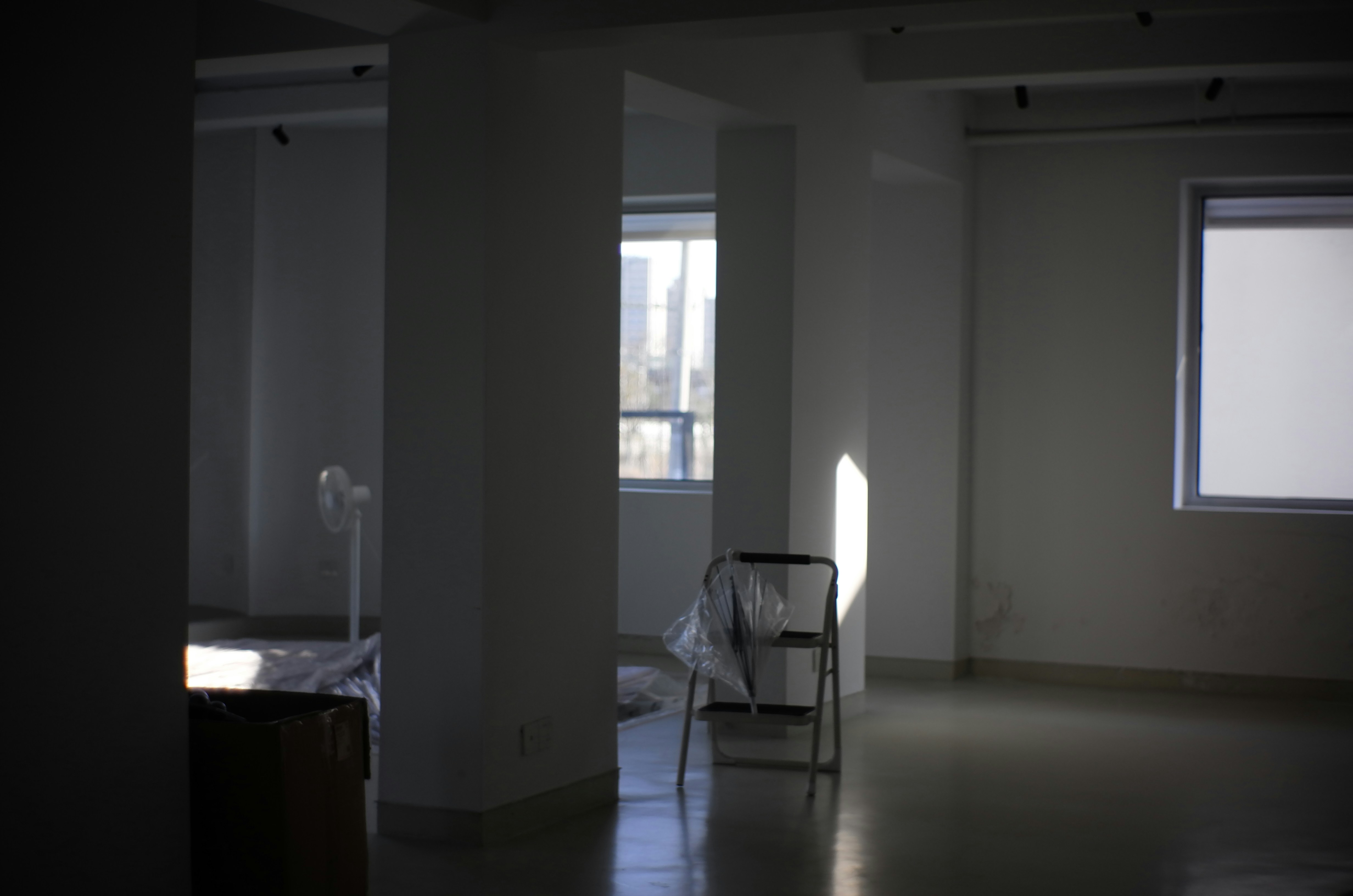 Empty room with sunlight streaming through window