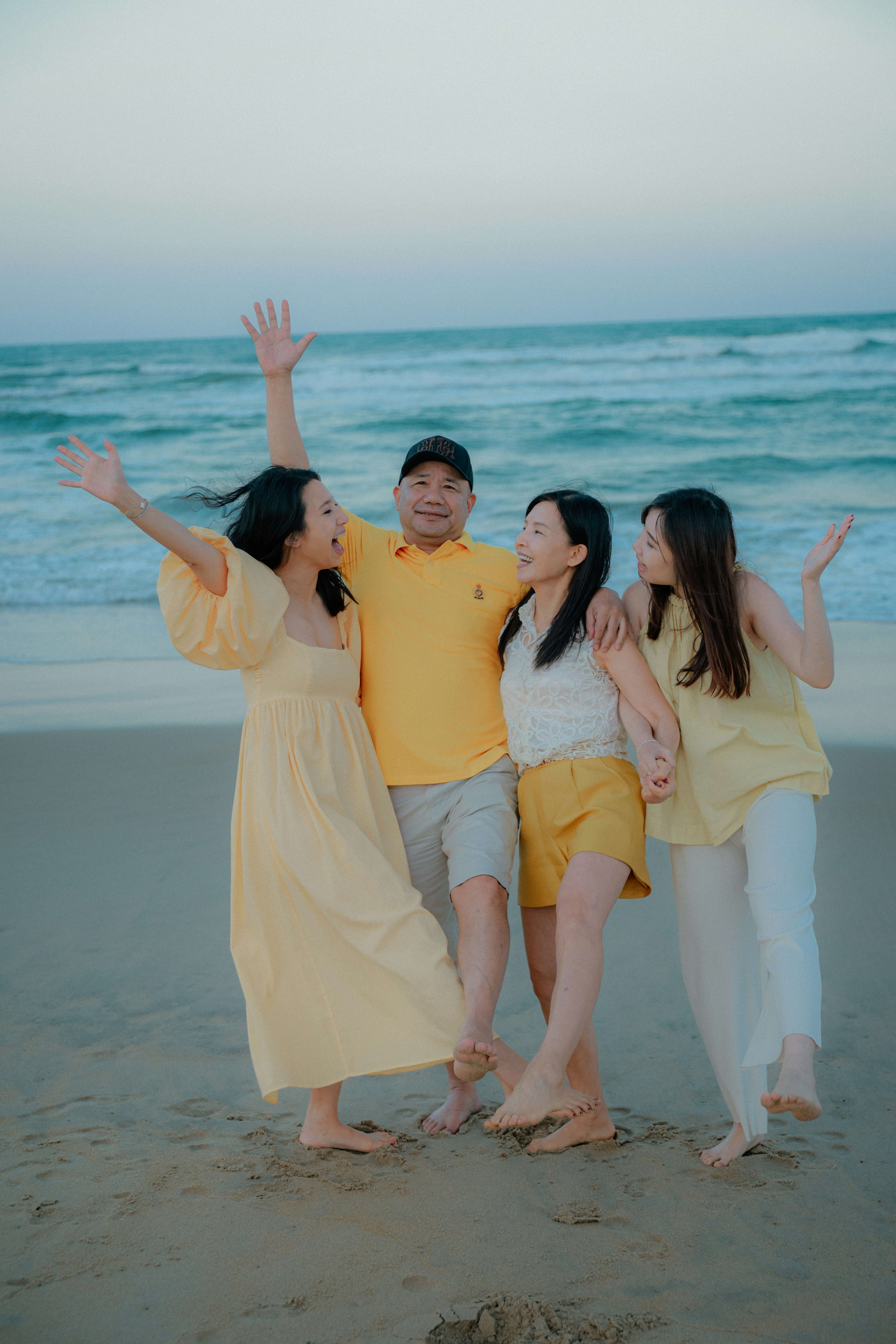 Beachside Cheer: A Family Moment in Sunlit Yellow