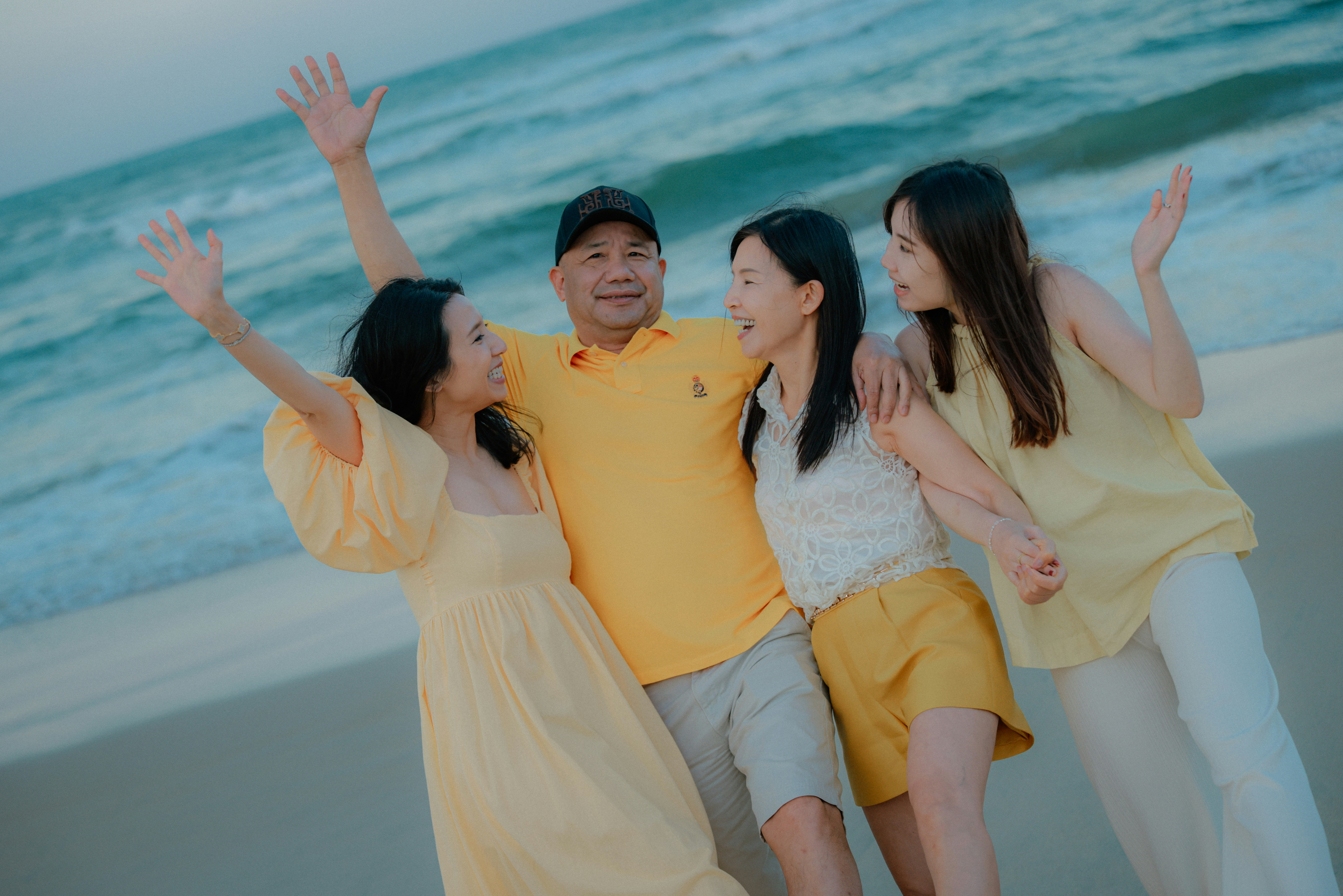 Sunlit Family Cheer on a Coastal Stretch