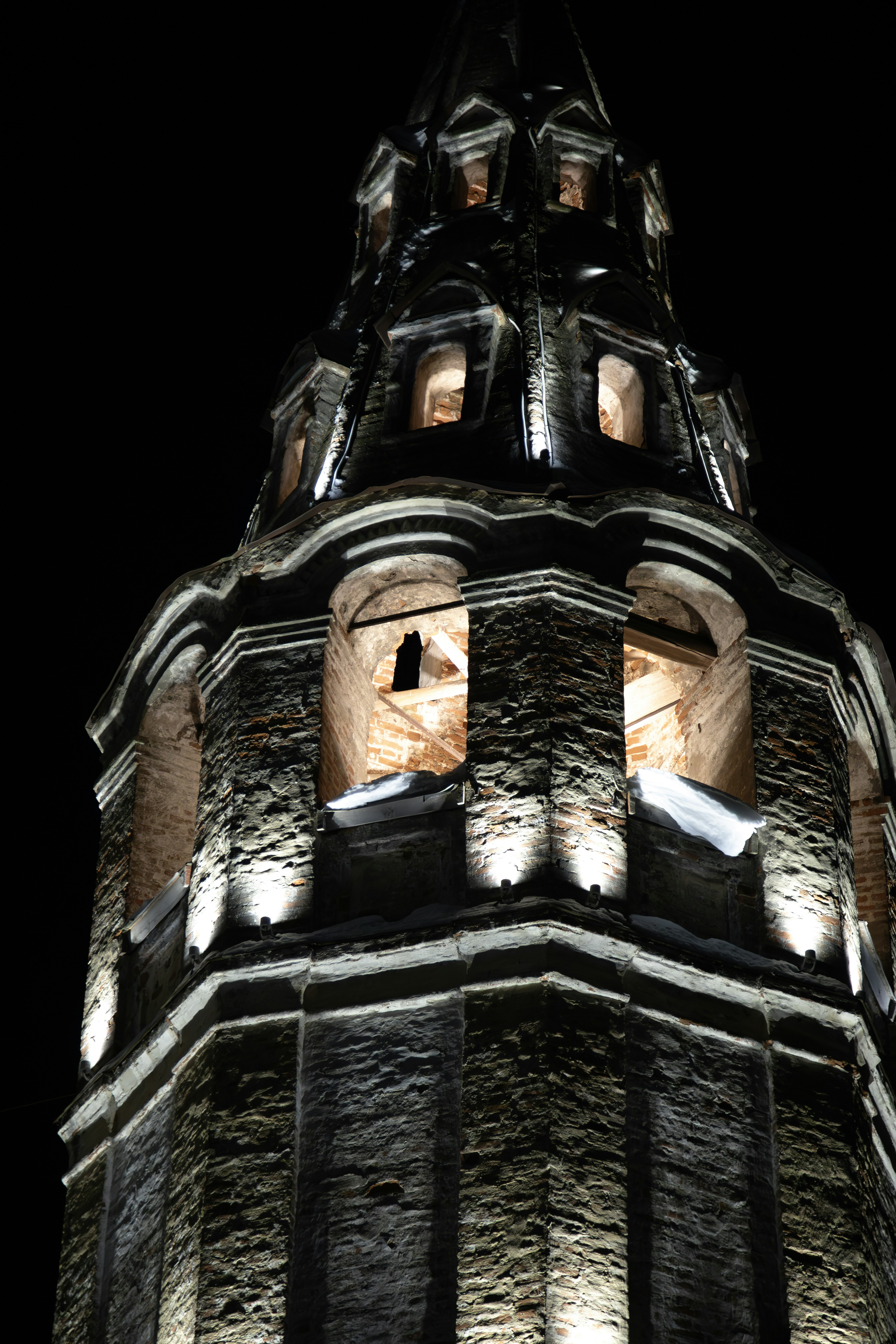 Moonlit Bell-Tower Ascending: An Illuminated Nighttime Facade Reaching Skyward