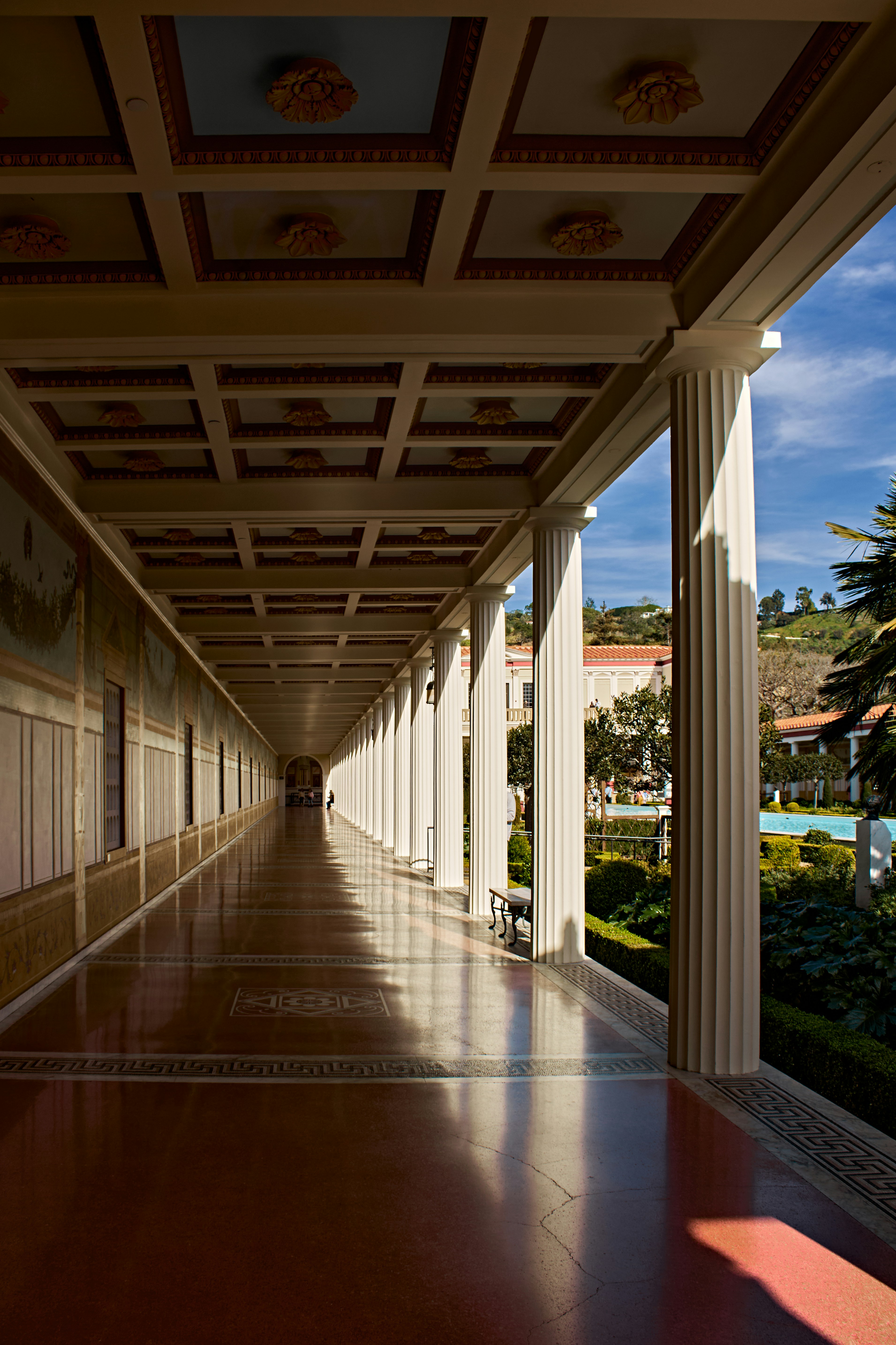 Colonnade Corridor: A Vanishing Path of Light and Tile
