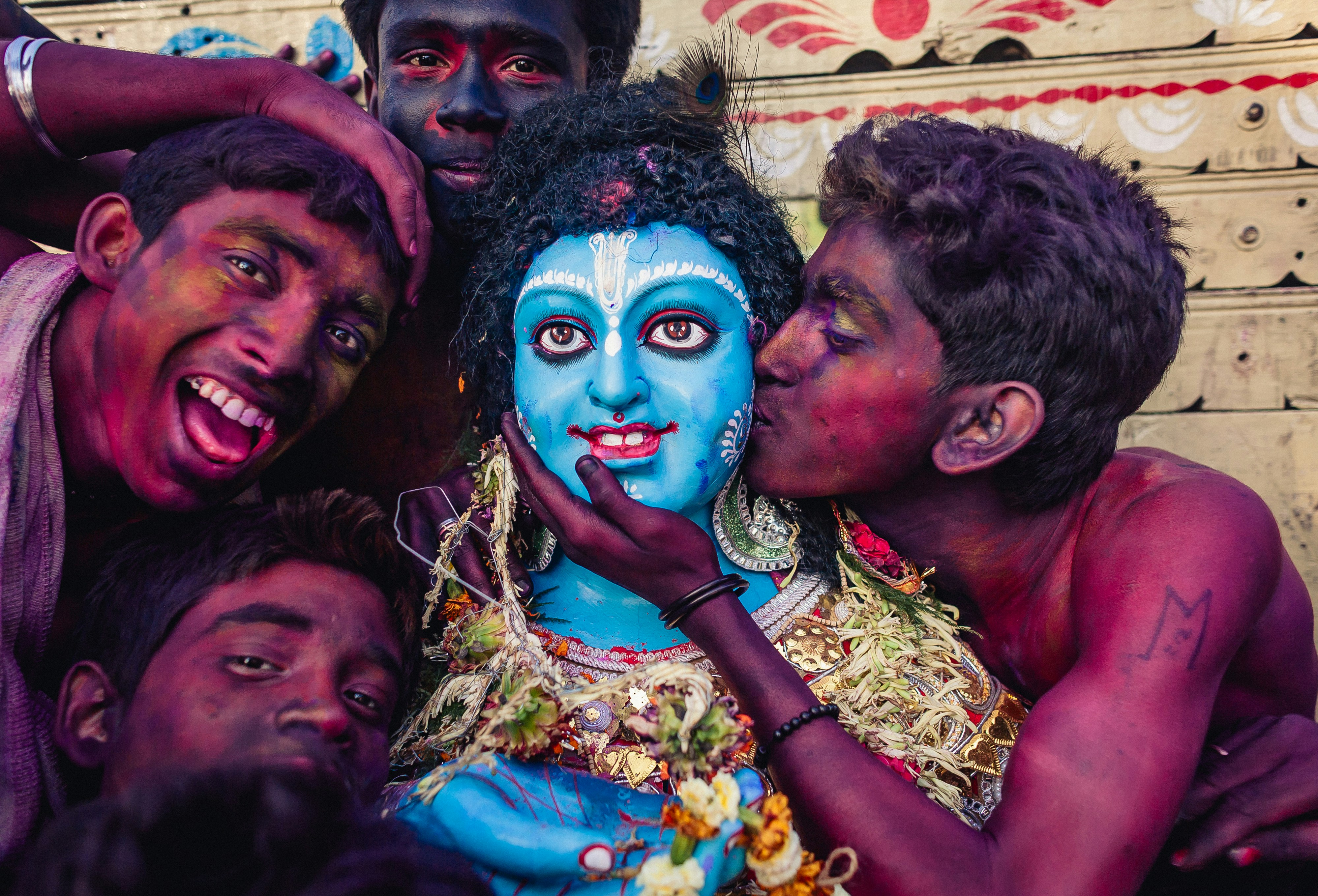 Blue-face Ritual: A Cherished Moment among Colorful Revelers