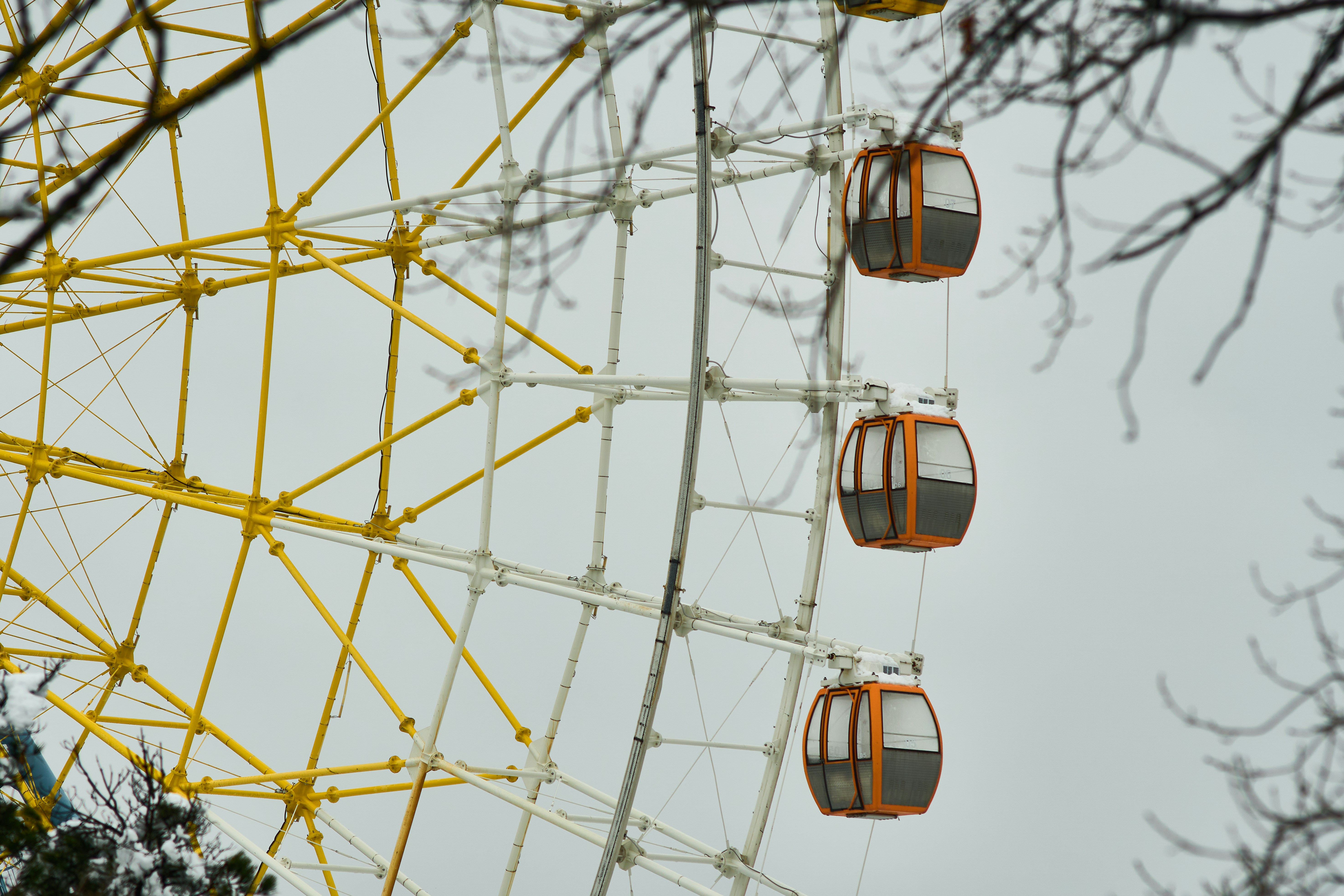 Yellow-and-white Ferris Wheel Spokes Against Winter Sky