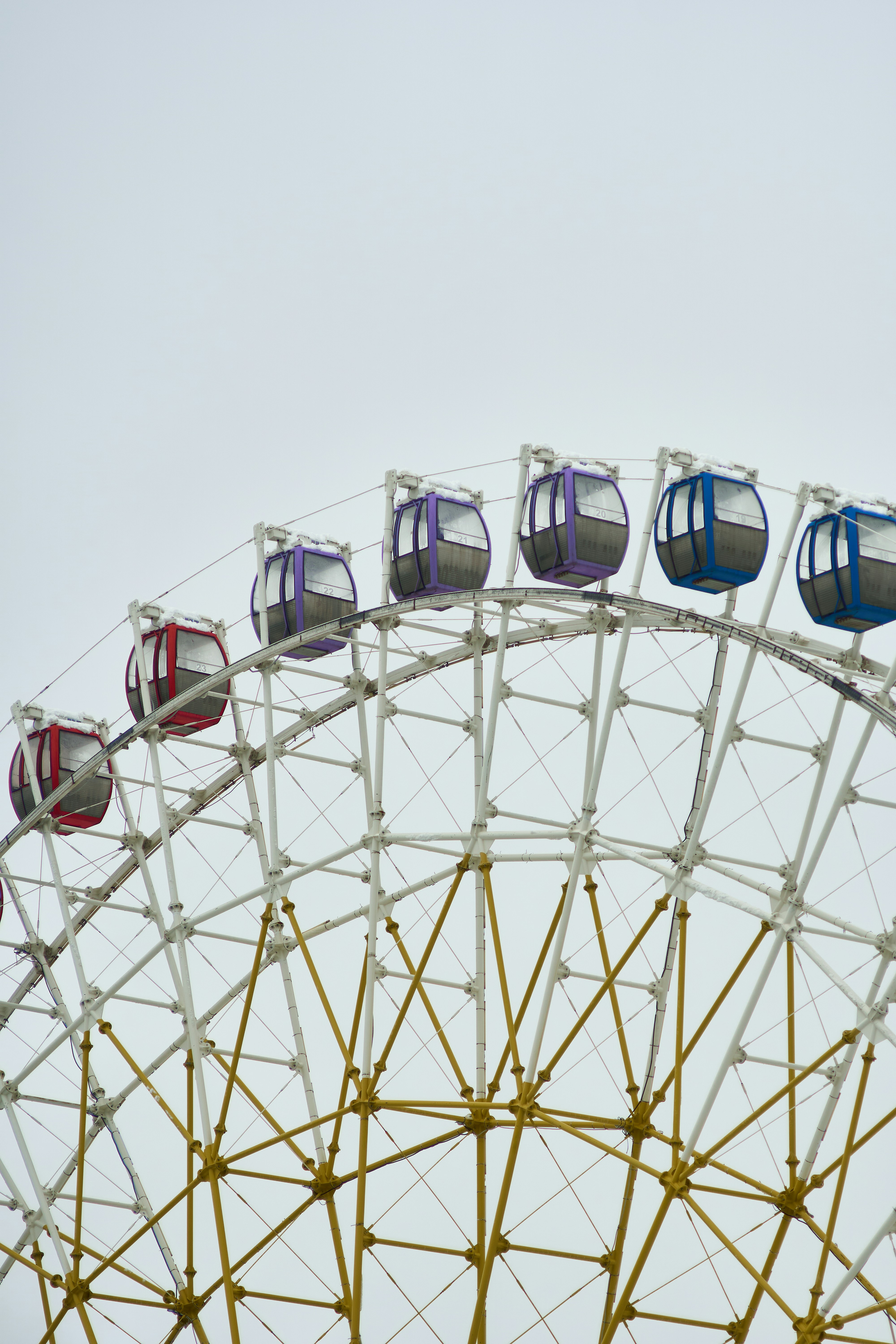 Colorful Ferris Wheel Arches Against a Clear Sky