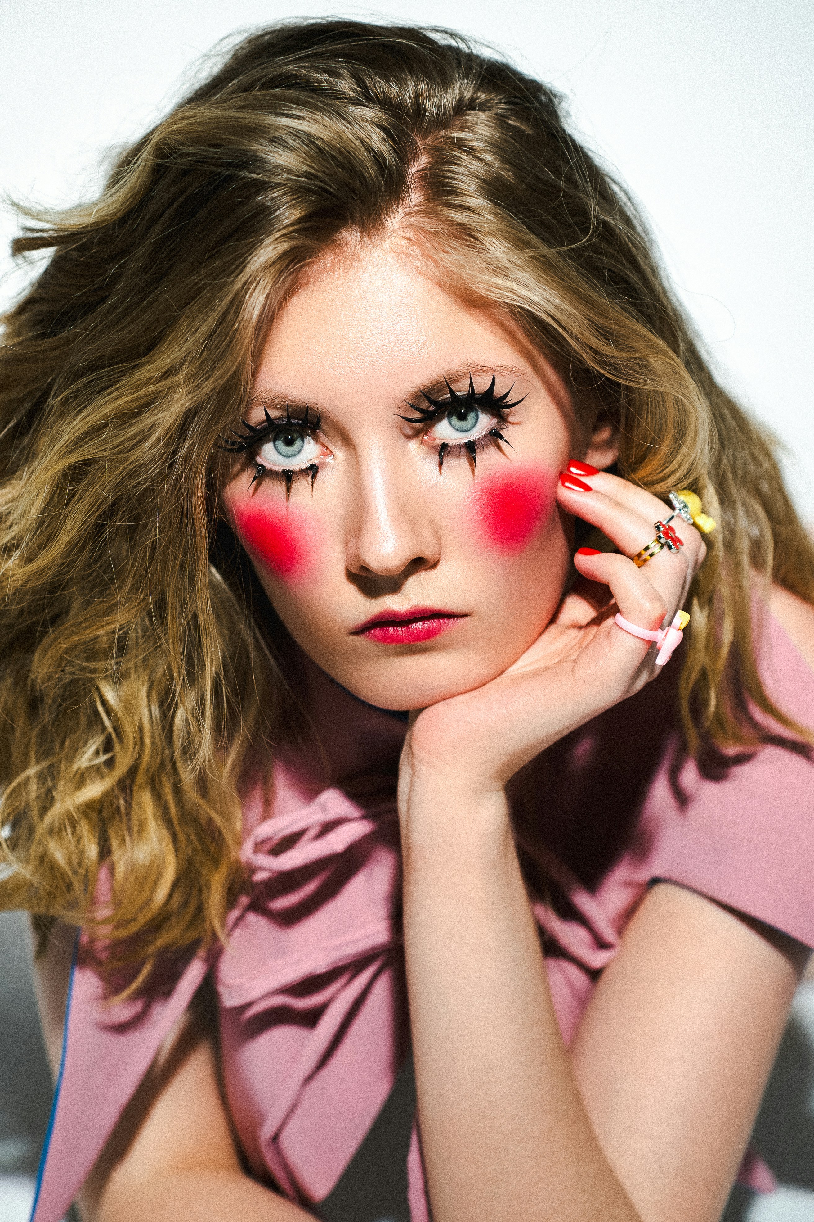 Expression in Stitches: A Bold Portrait of Dramatic Makeup and Soft Light