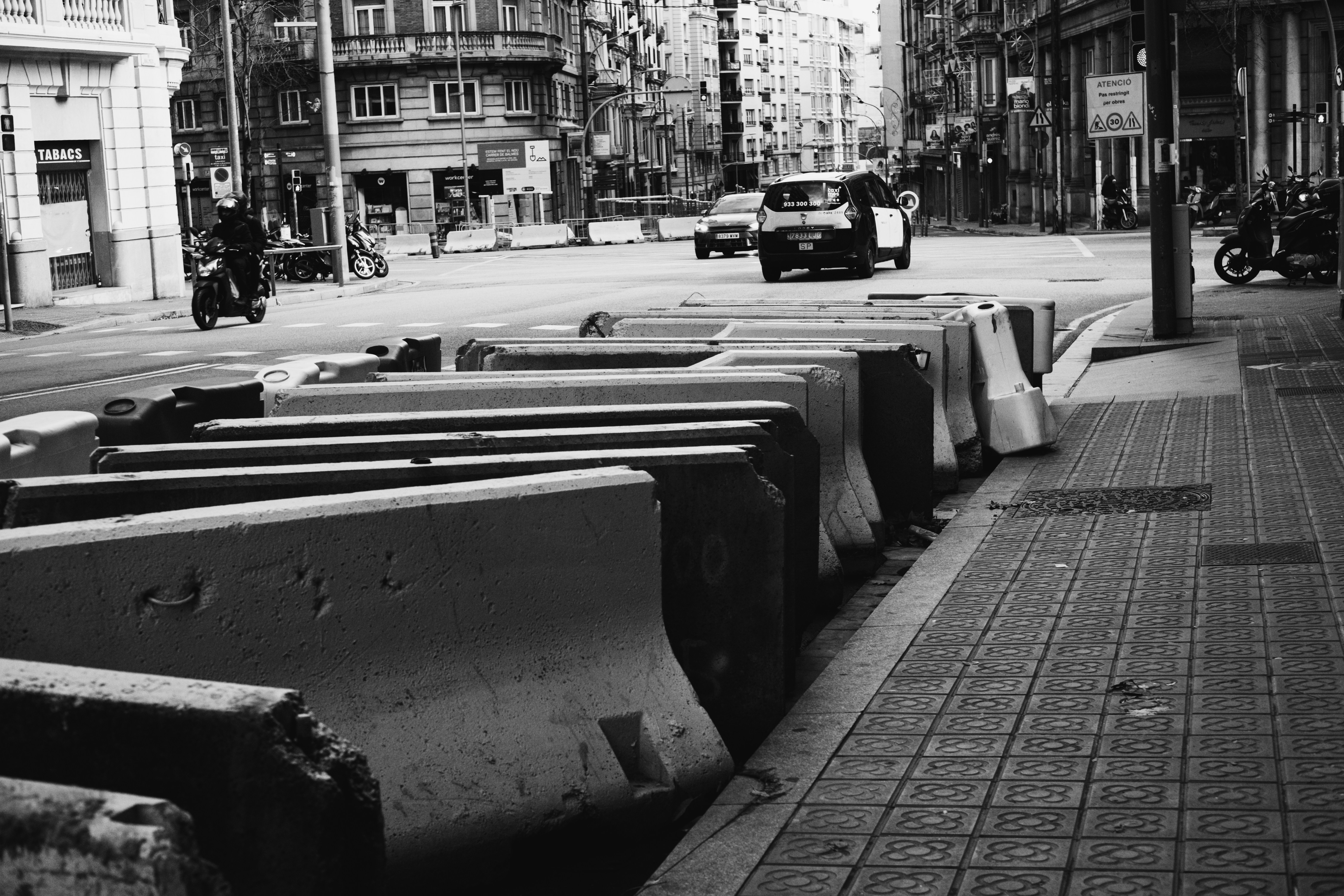Urban Barricade Alley: A Quiet Lull Between Traffic and Paving