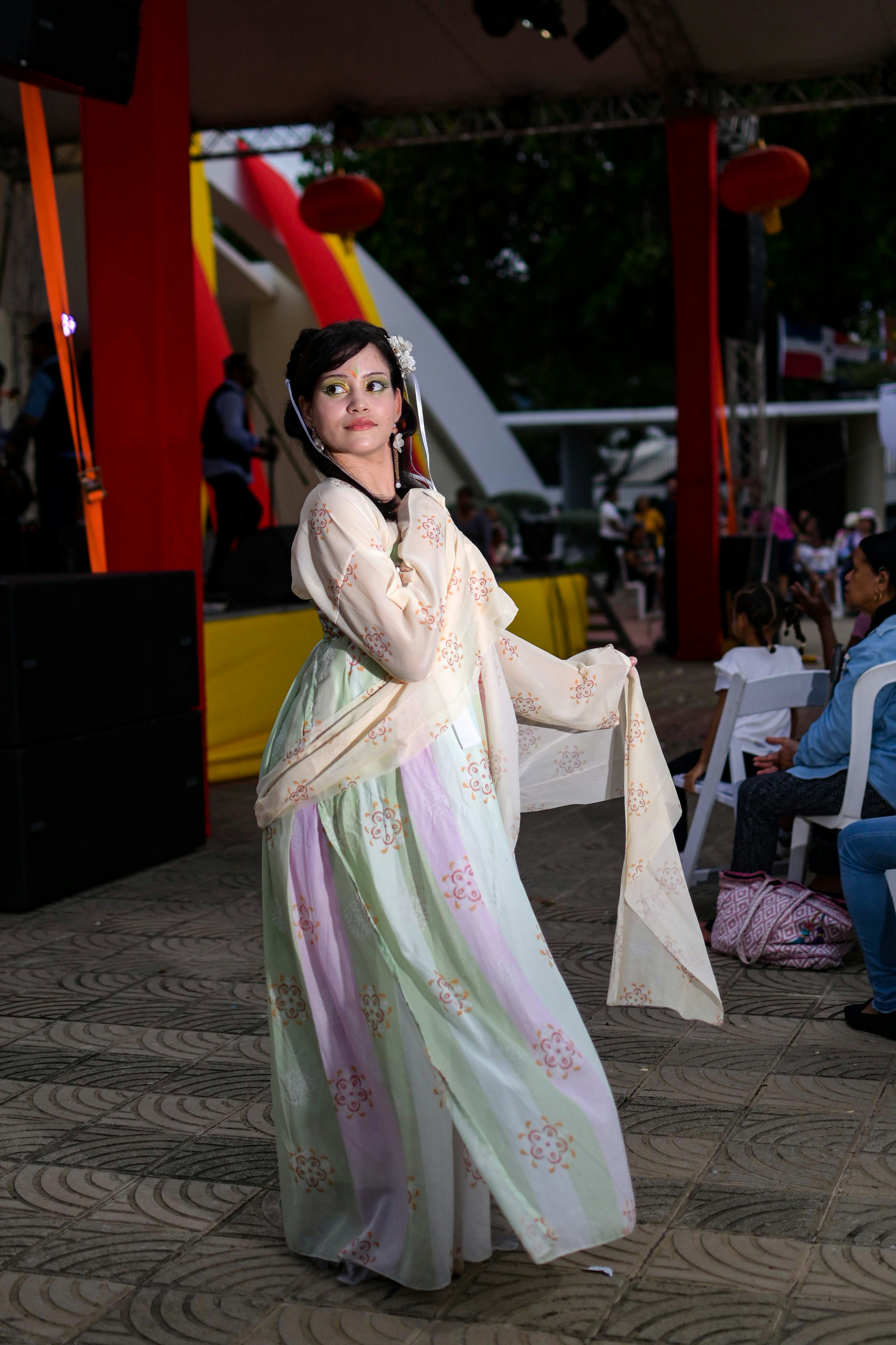 Graceful Veil: A Traditional-Hued Moment Under Red Lanterns