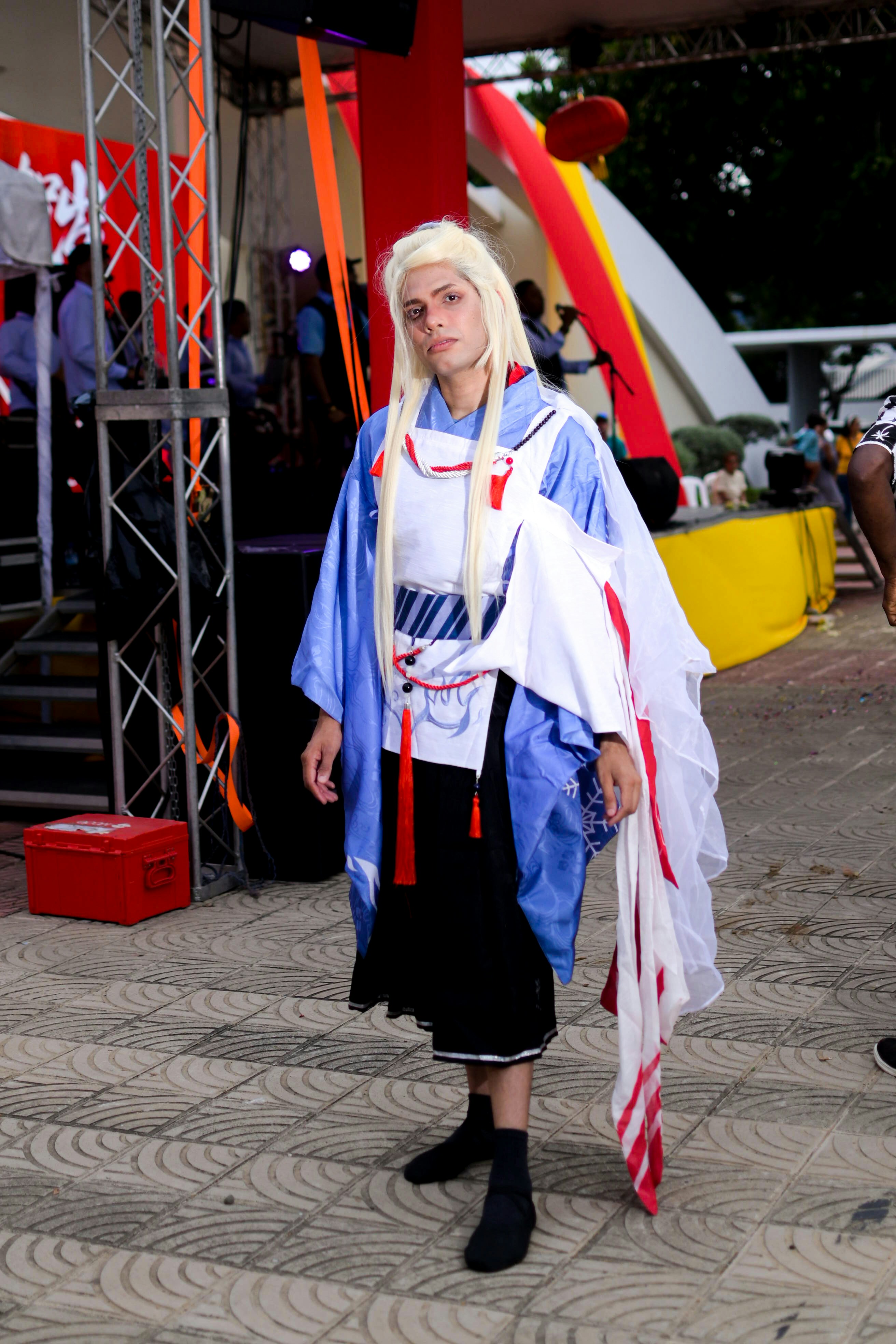Cosplay Portrait Under Carnival Arches: A Confident Geisha-Inspired Attendee