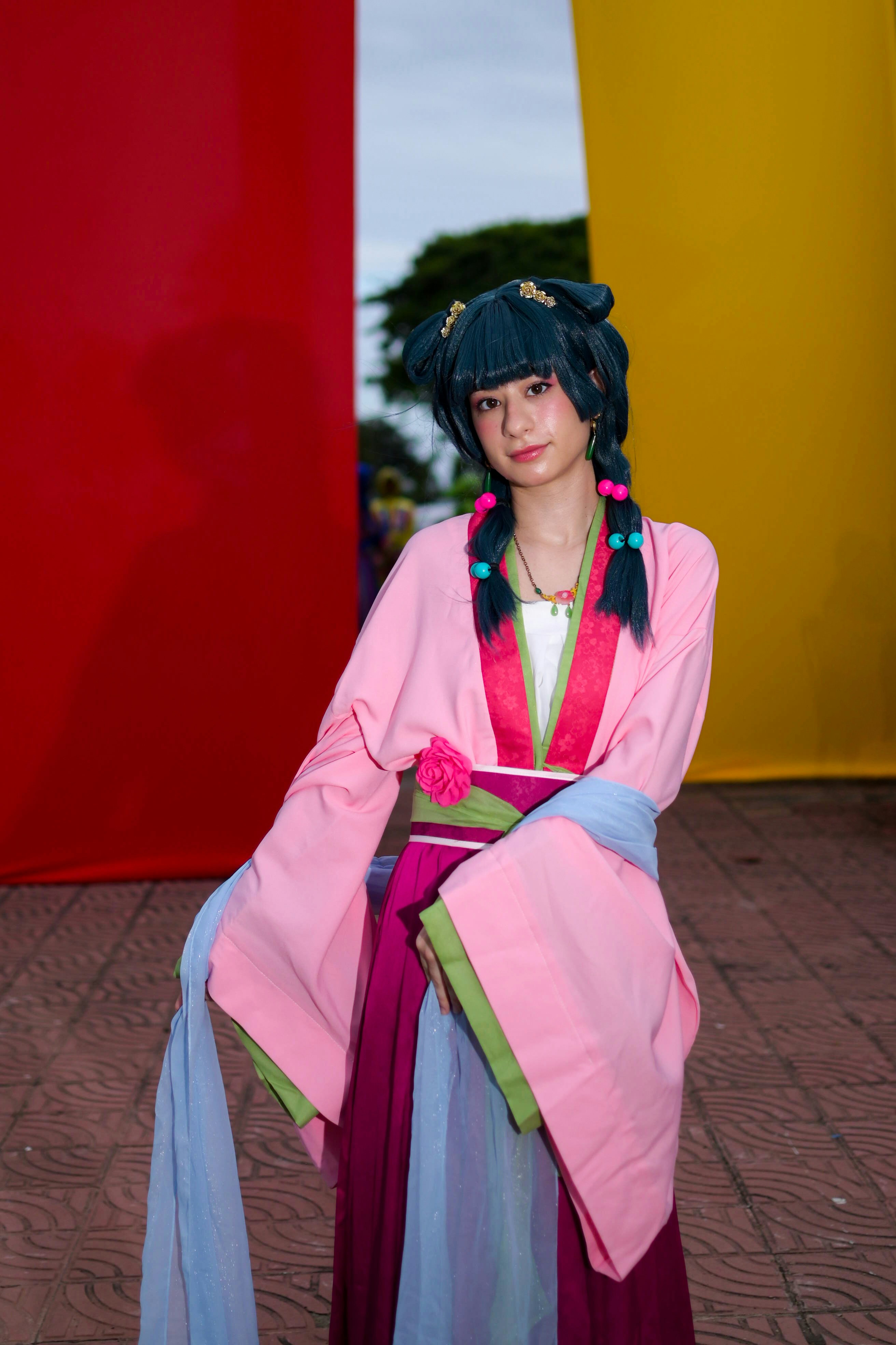 Cosplay in Bloom: A Portrait Amid Colorful Pillars