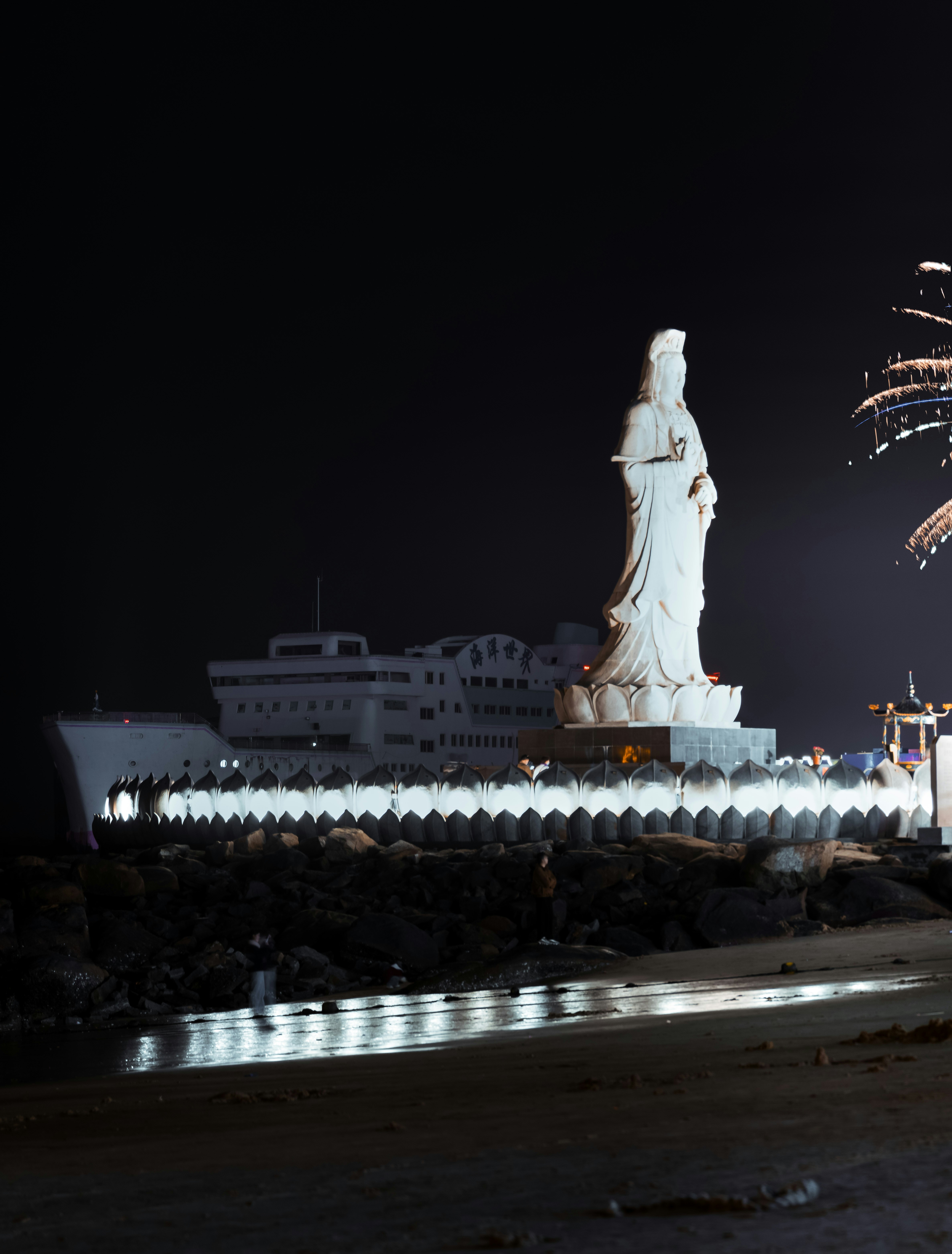Nighttime Harbor Statue: Serenity by the Sea