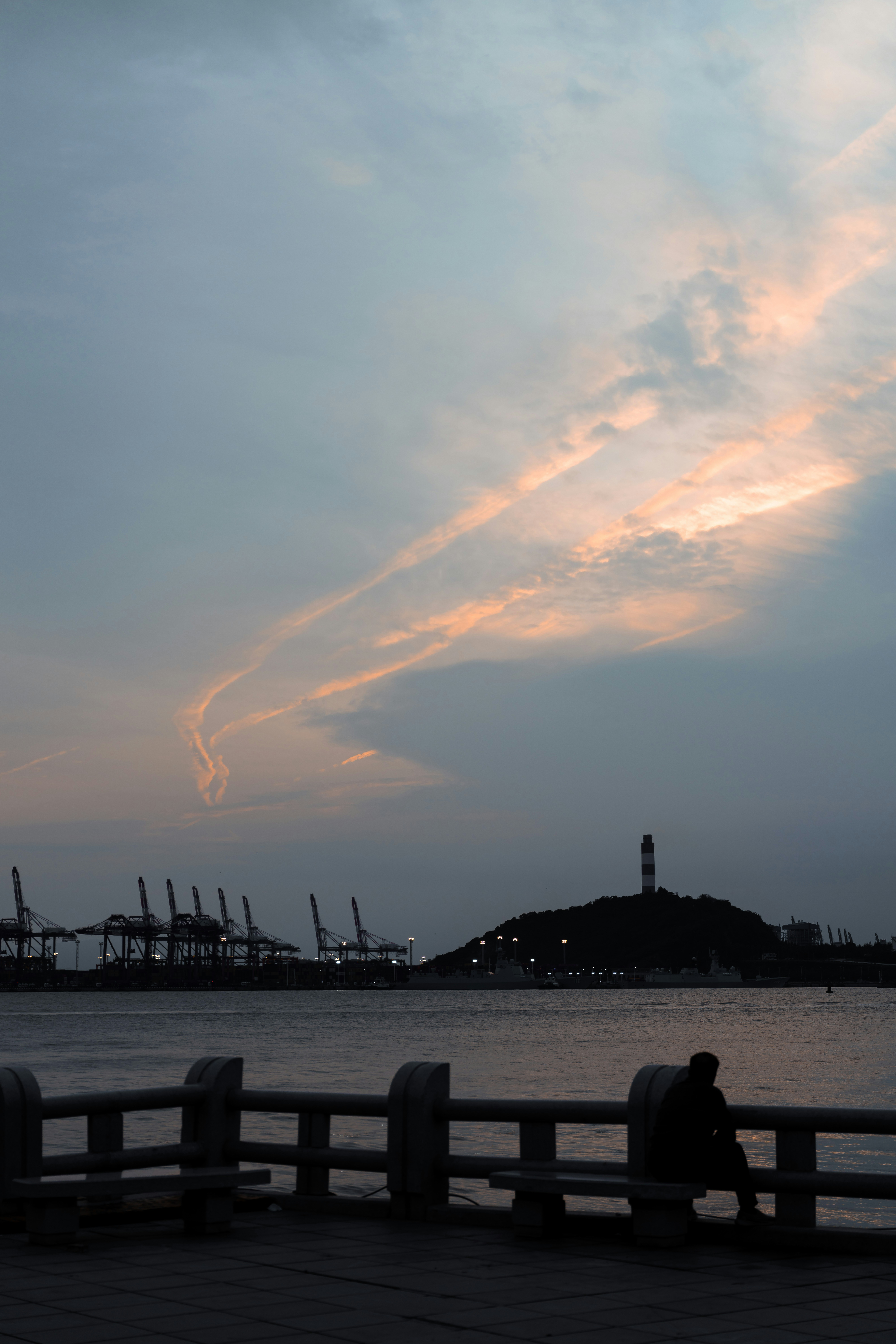 Twilight Pier: Quiet Sea, Distant Lighthouse