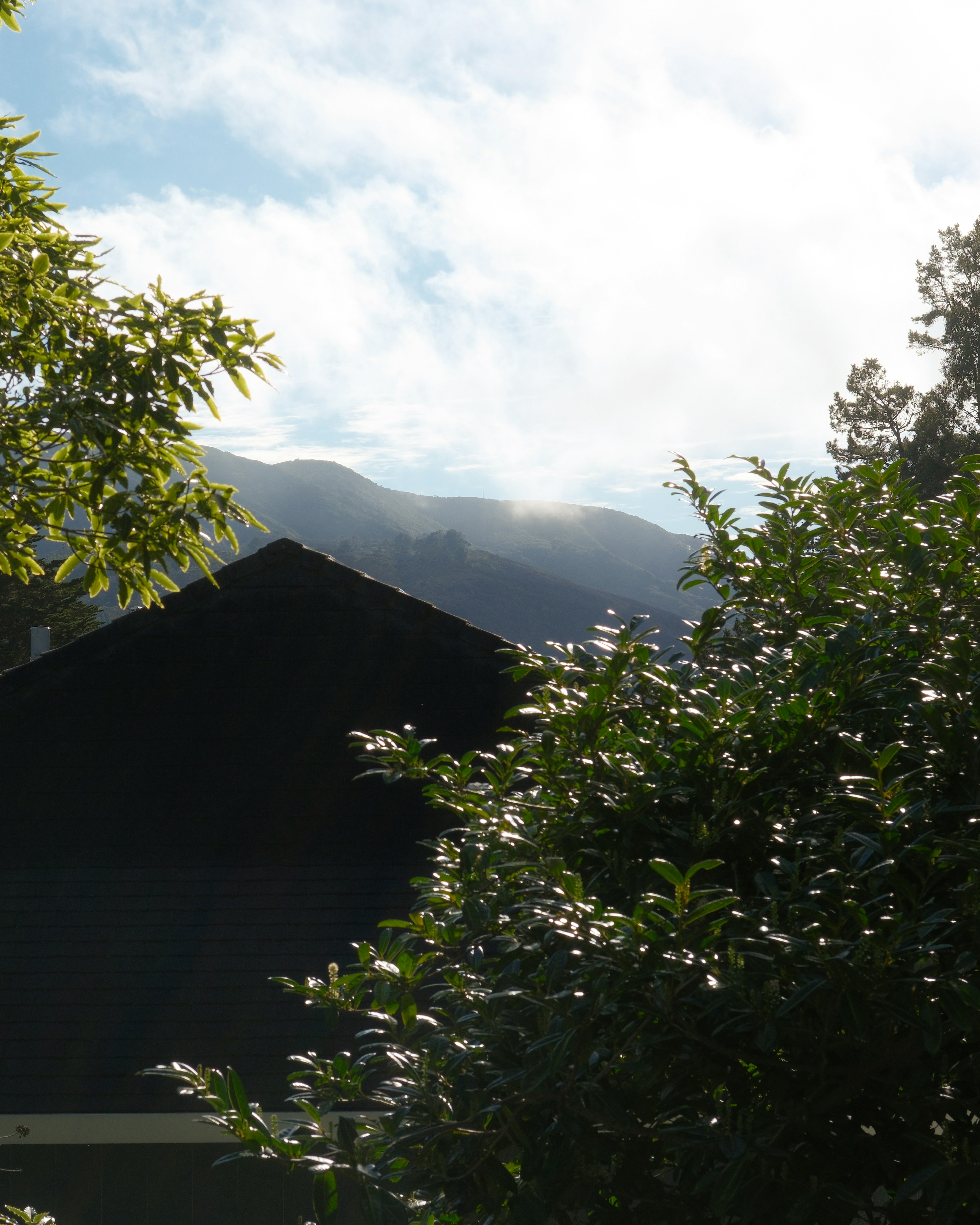 Sunlit Ridge Over House: Quiet Mountain Dawn